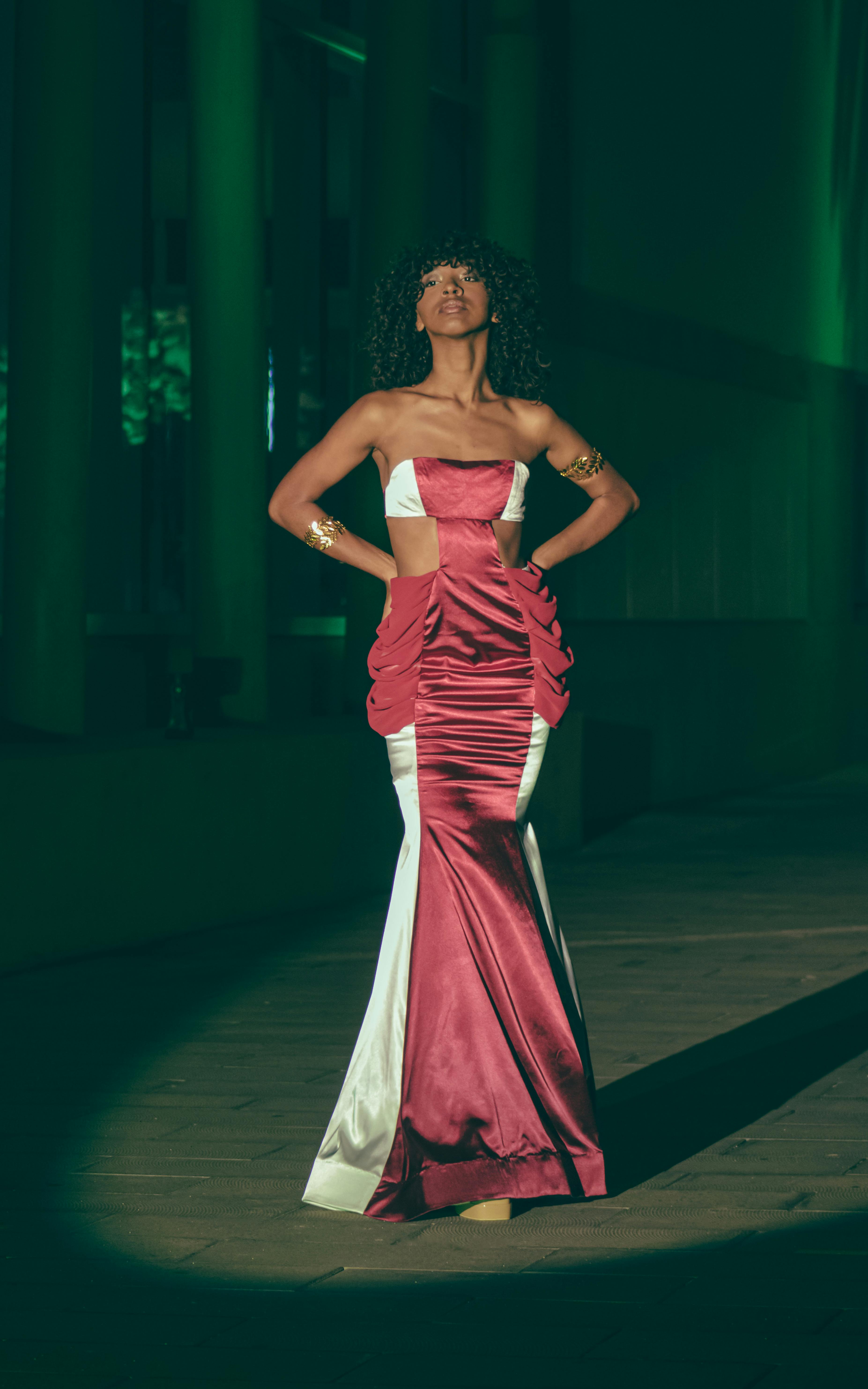 Beautiful Woman in Black Dress Posing on Lakeshore · Free Stock Photo