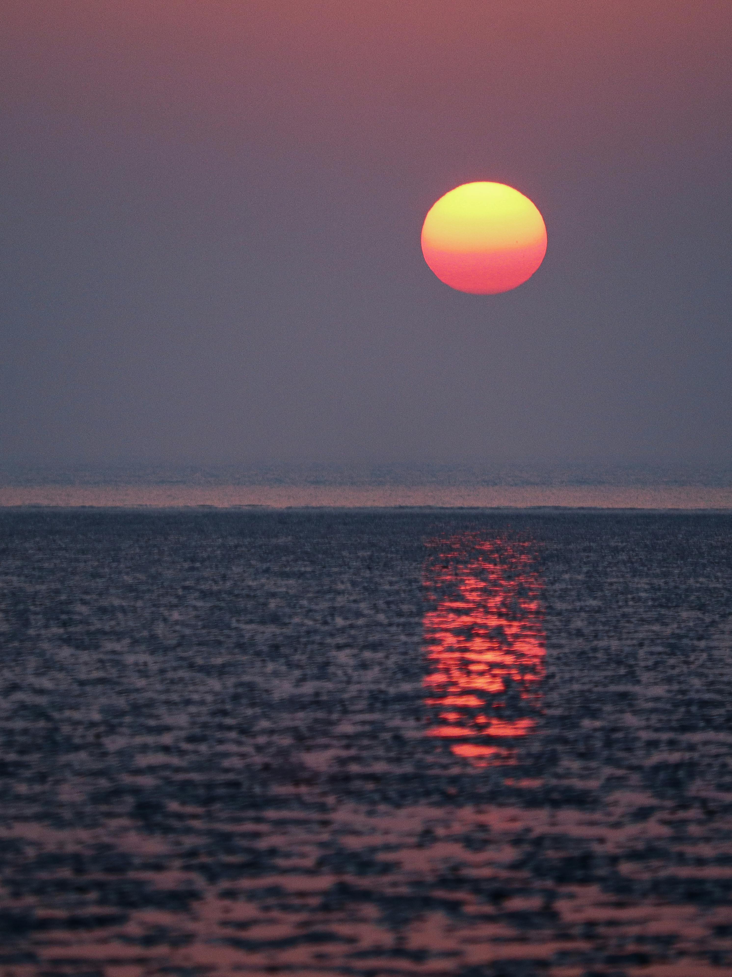 Setting Sun Reflecting in the Ocean Waters · Free Stock Photo