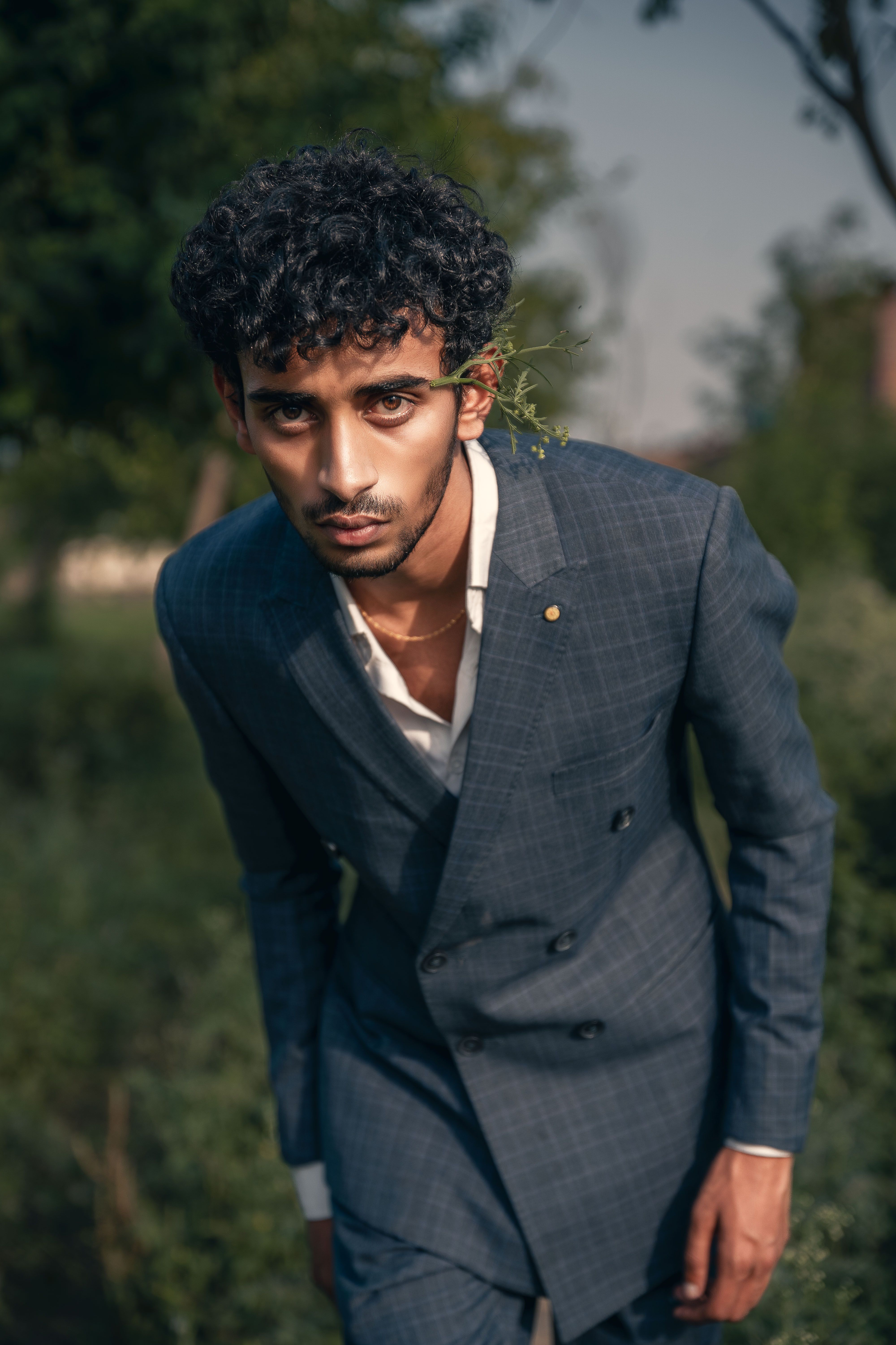 Handsome Man in a Suit with a Twig Behind His Ear · Free Stock Photo