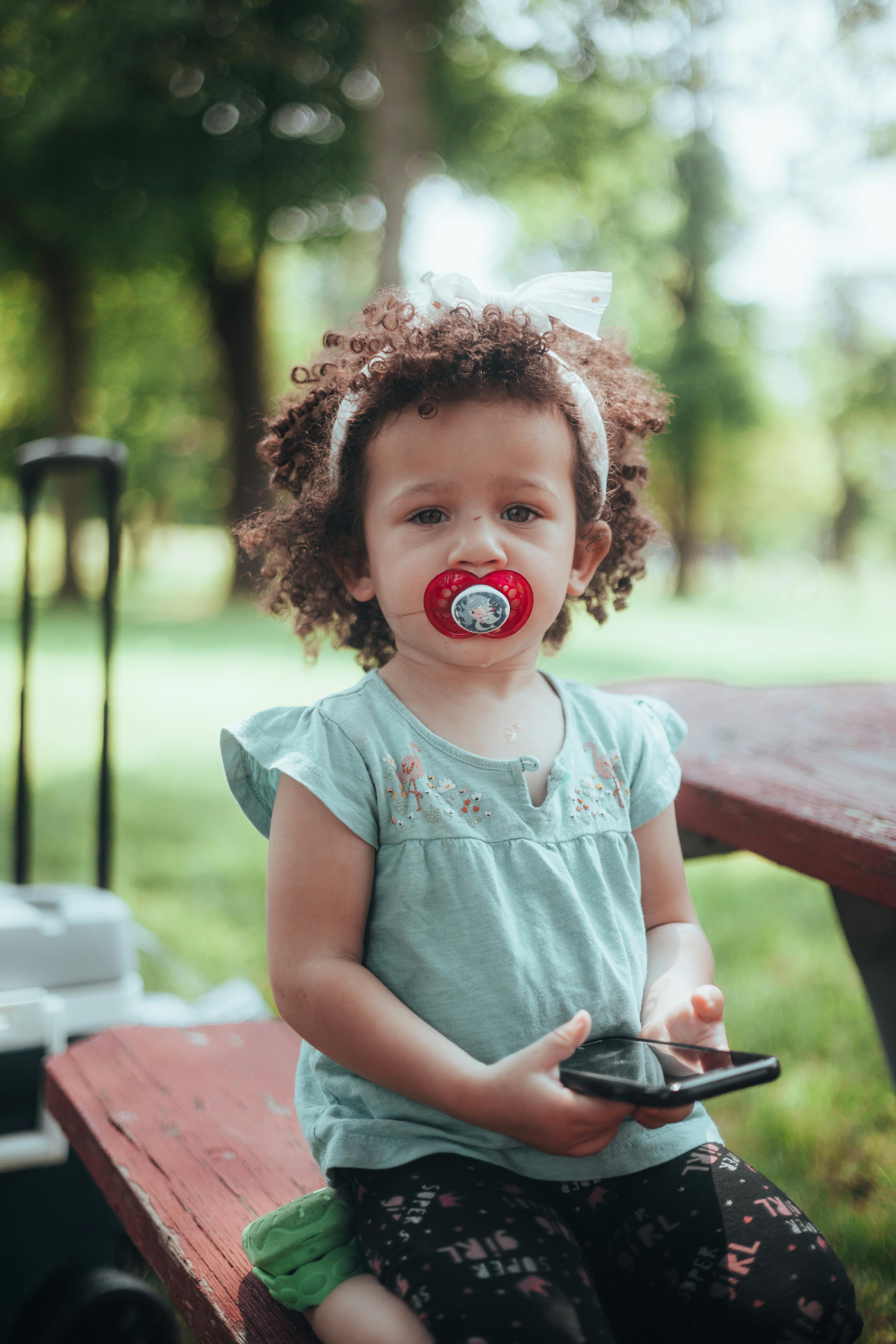 Portrait of Girl with Pacifier · Free Stock Photo