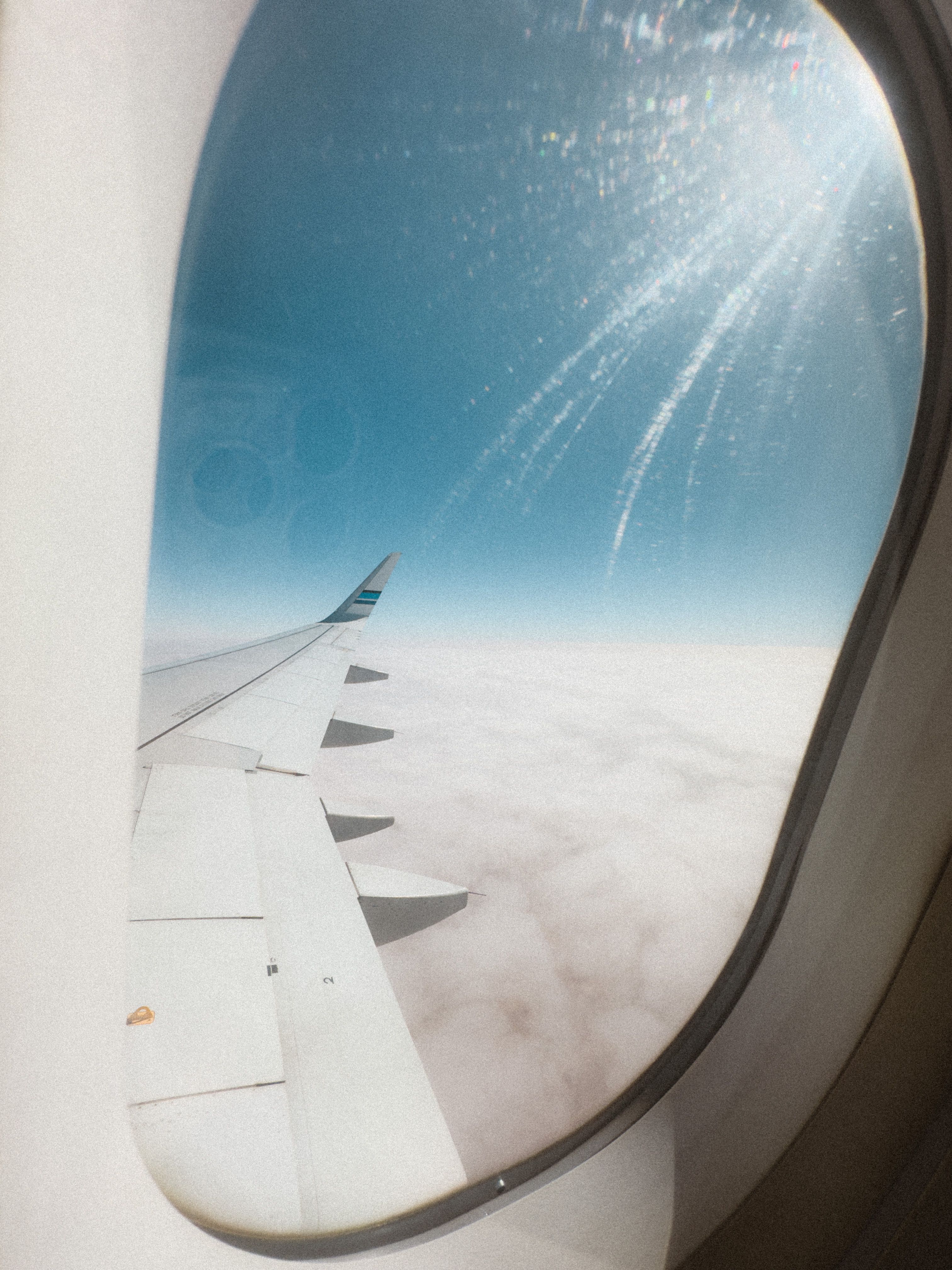 A view of an airplane window with the sun shining through · Free Stock ...