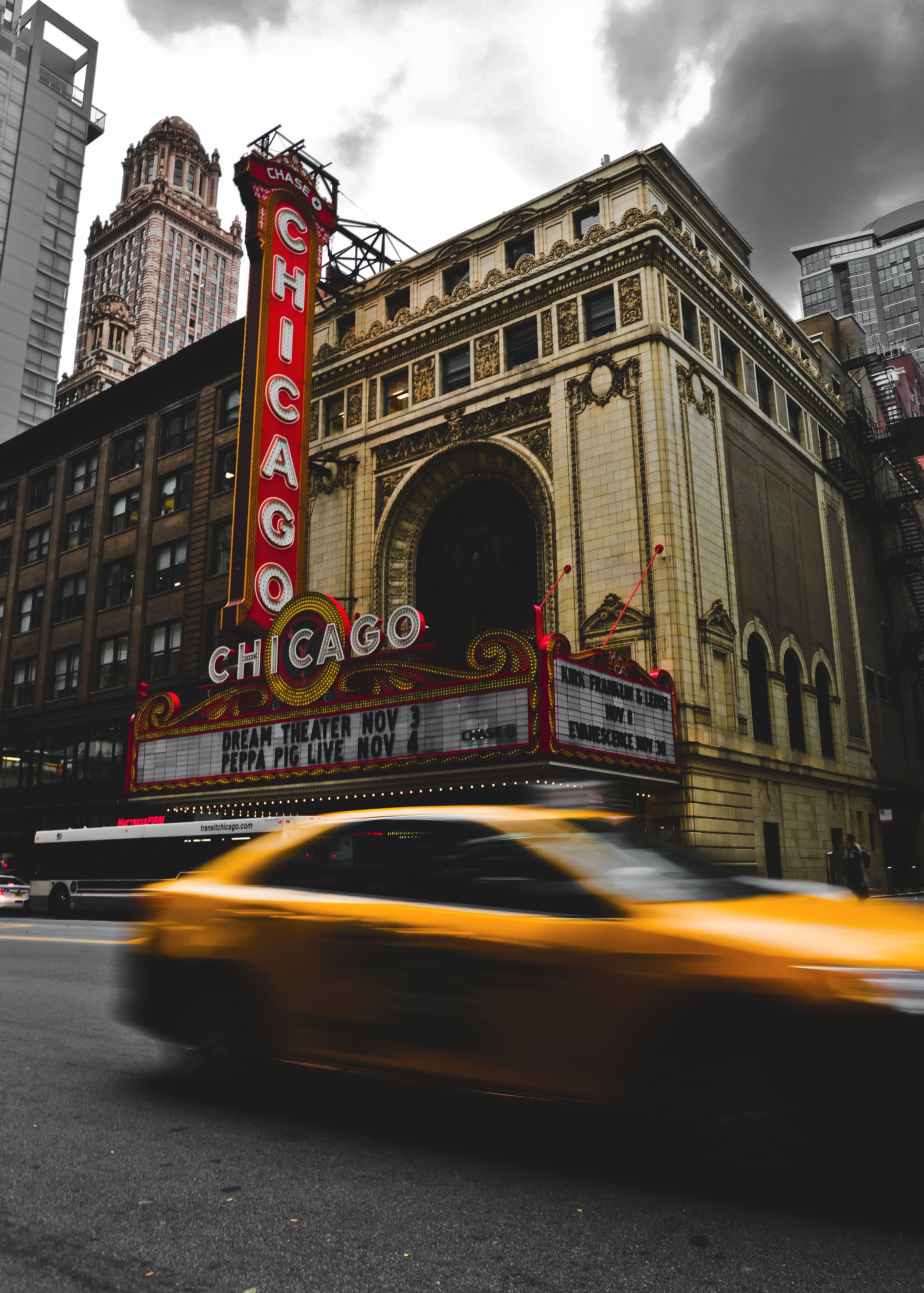 Passing Cars Near Chicago Theater · Free Stock Photo
