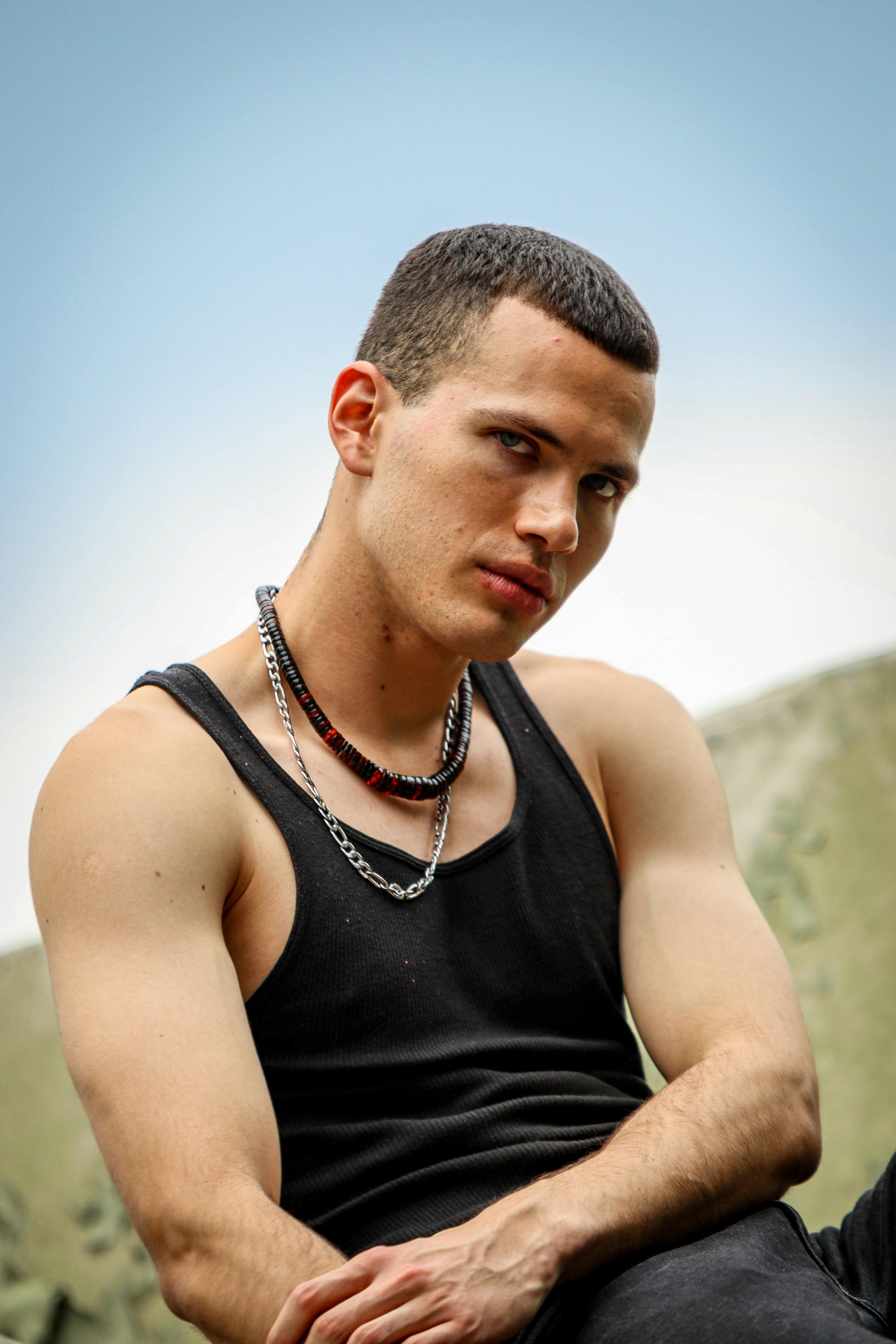 Smiling Man Sitting on Chair · Free Stock Photo