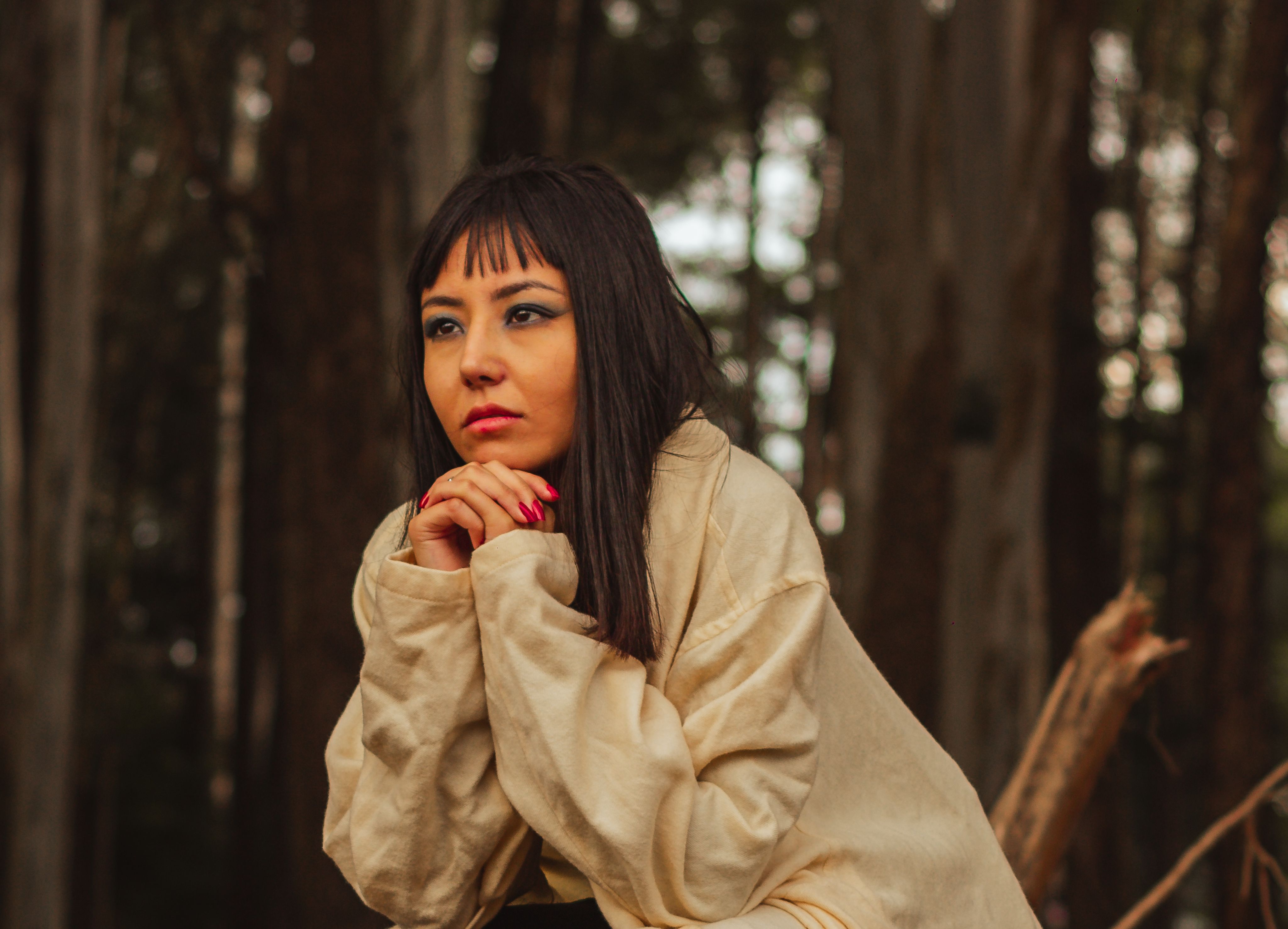 Woman Thinking with Hand on Cheek · Free Stock Photo