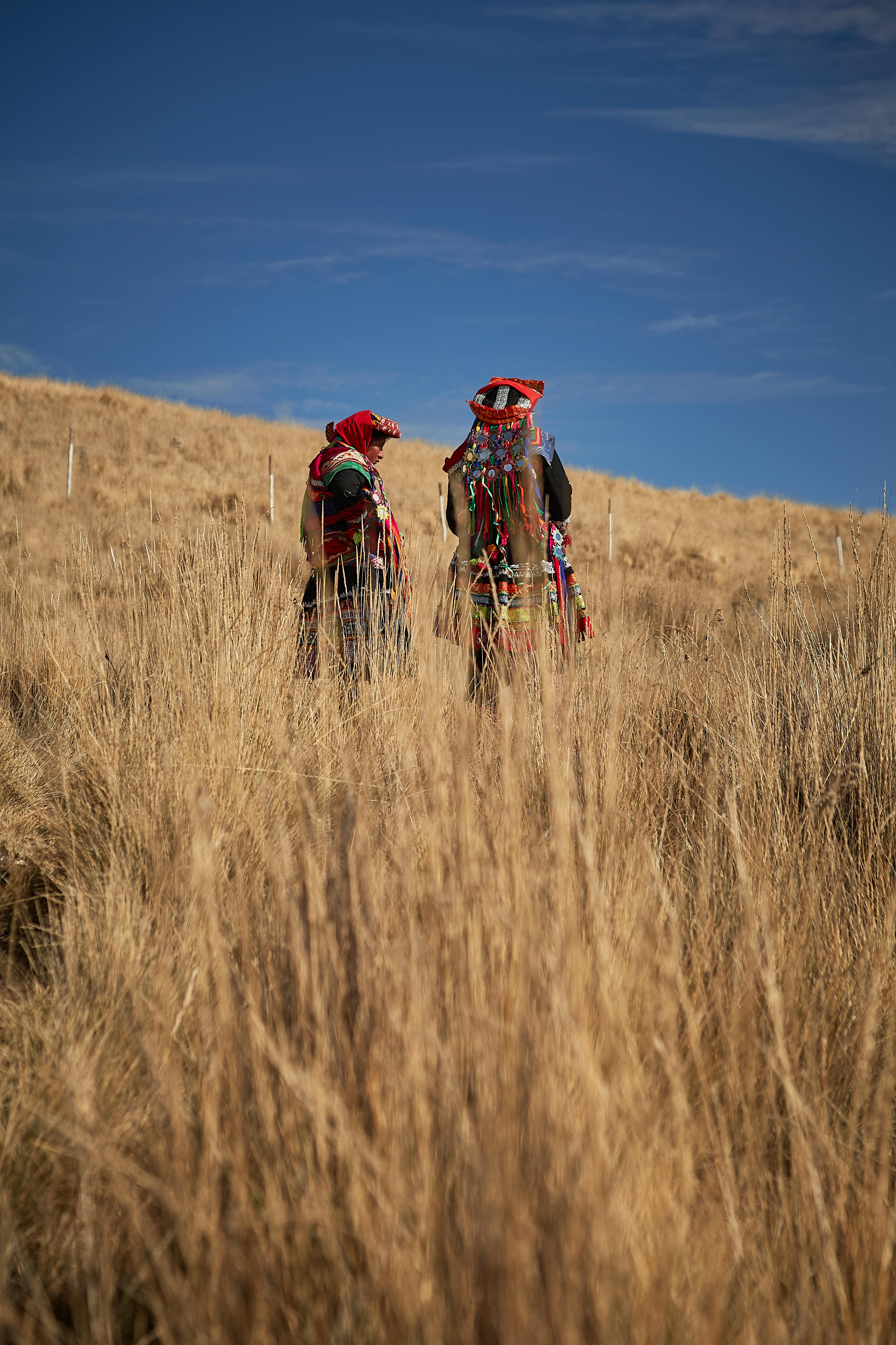 A Person Standing in Black Robe Wearing Kaffiyeh · Free Stock Photo