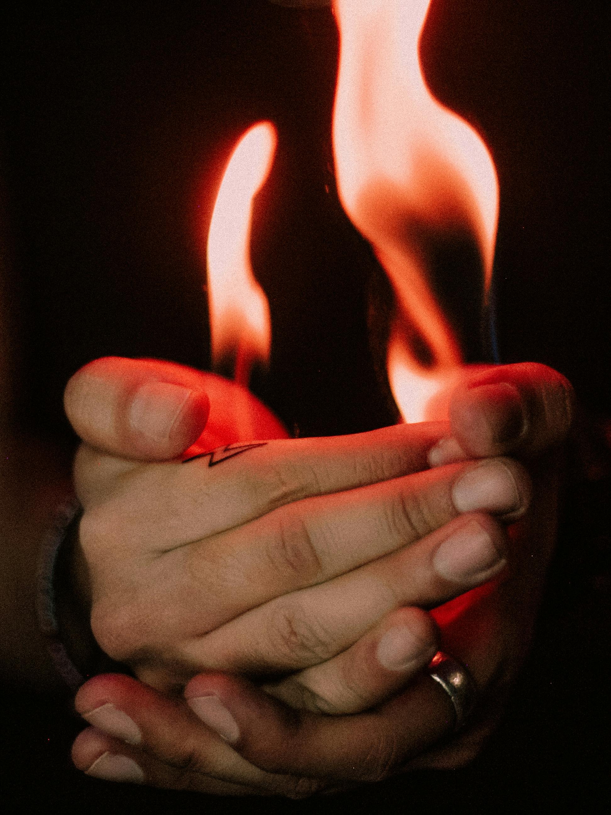 Close-up of Fire Burning in Hands · Free Stock Photo