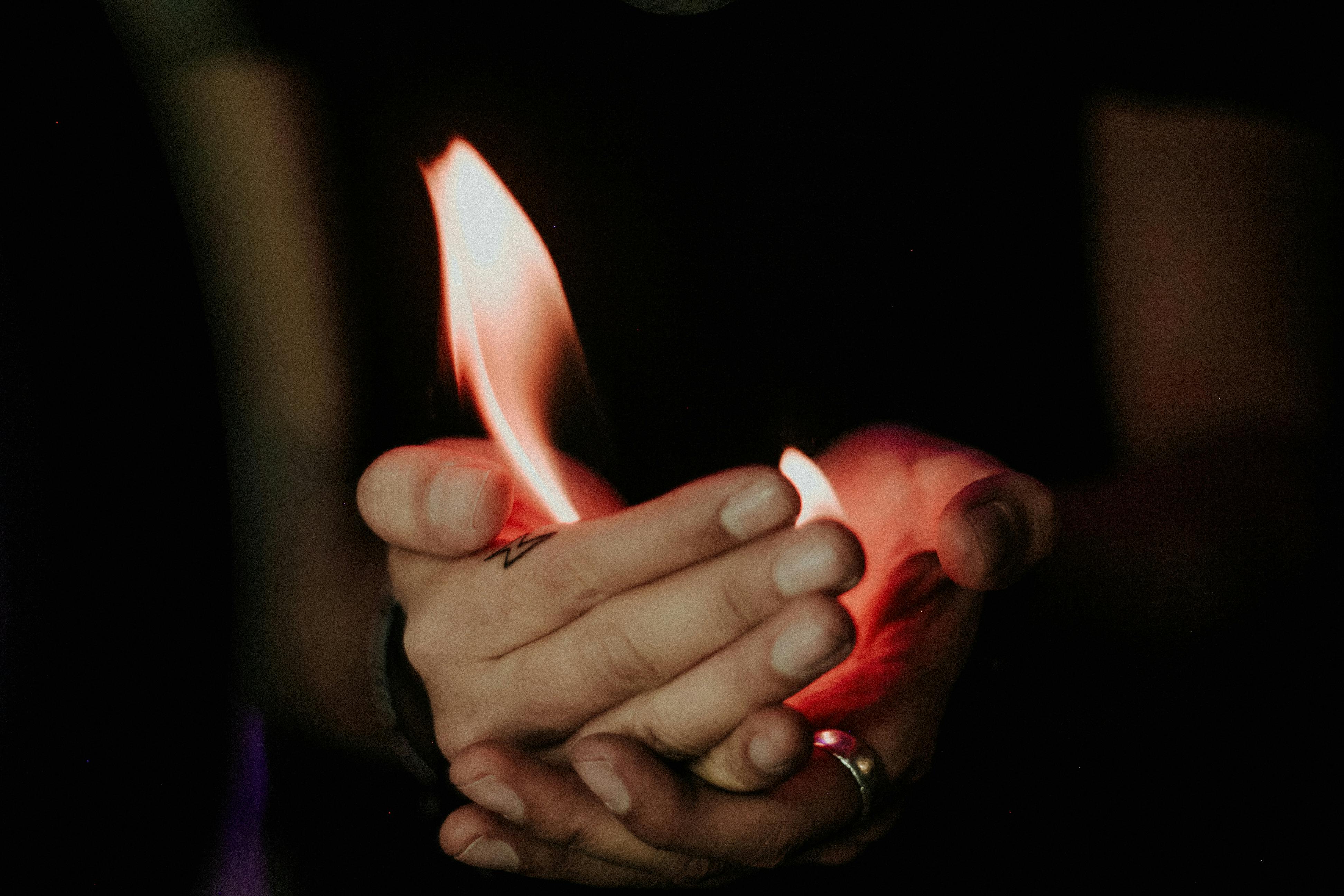 Close-up of Fire Burning in Hands · Free Stock Photo