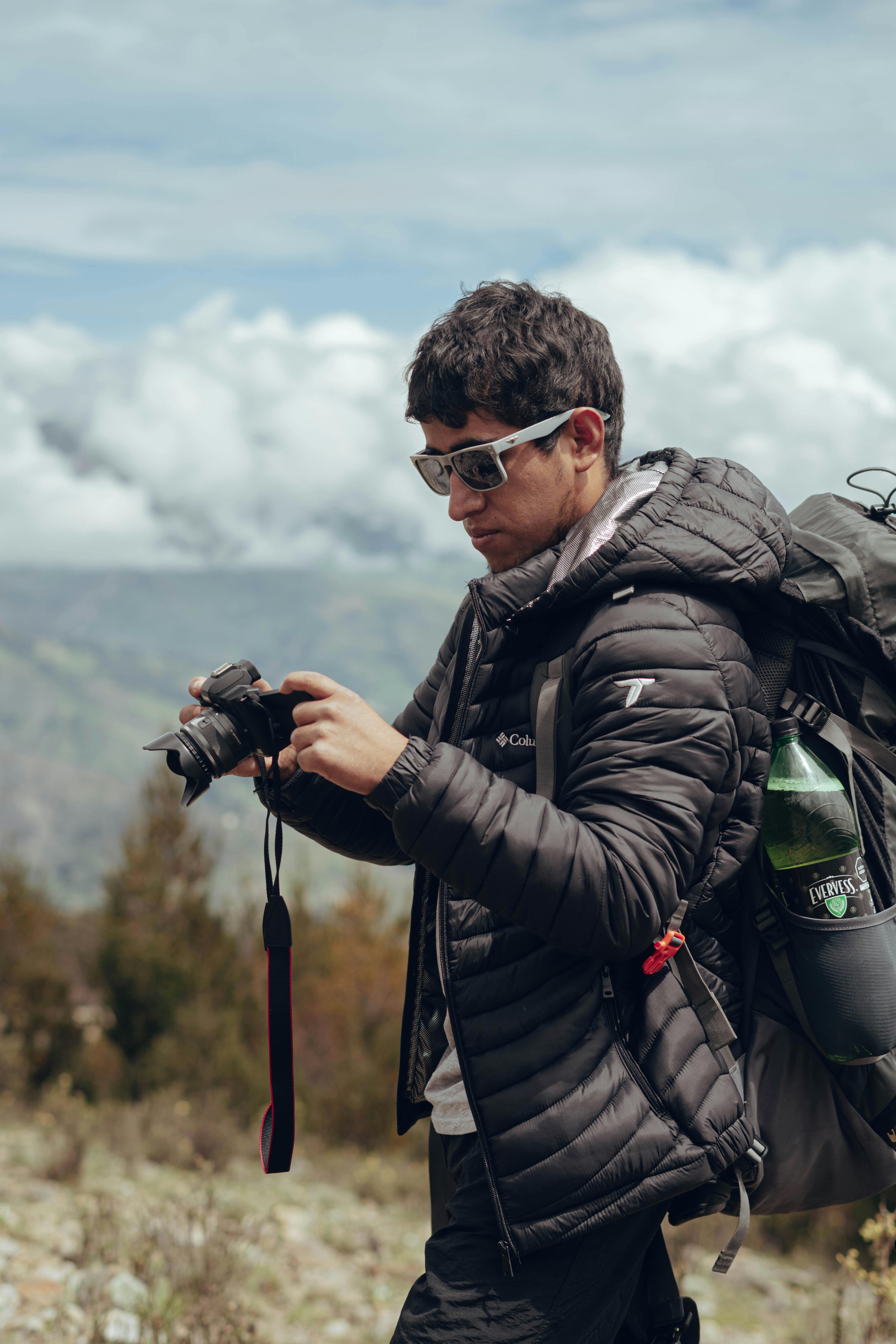 Man in Jacket and with Camera · Free Stock Photo