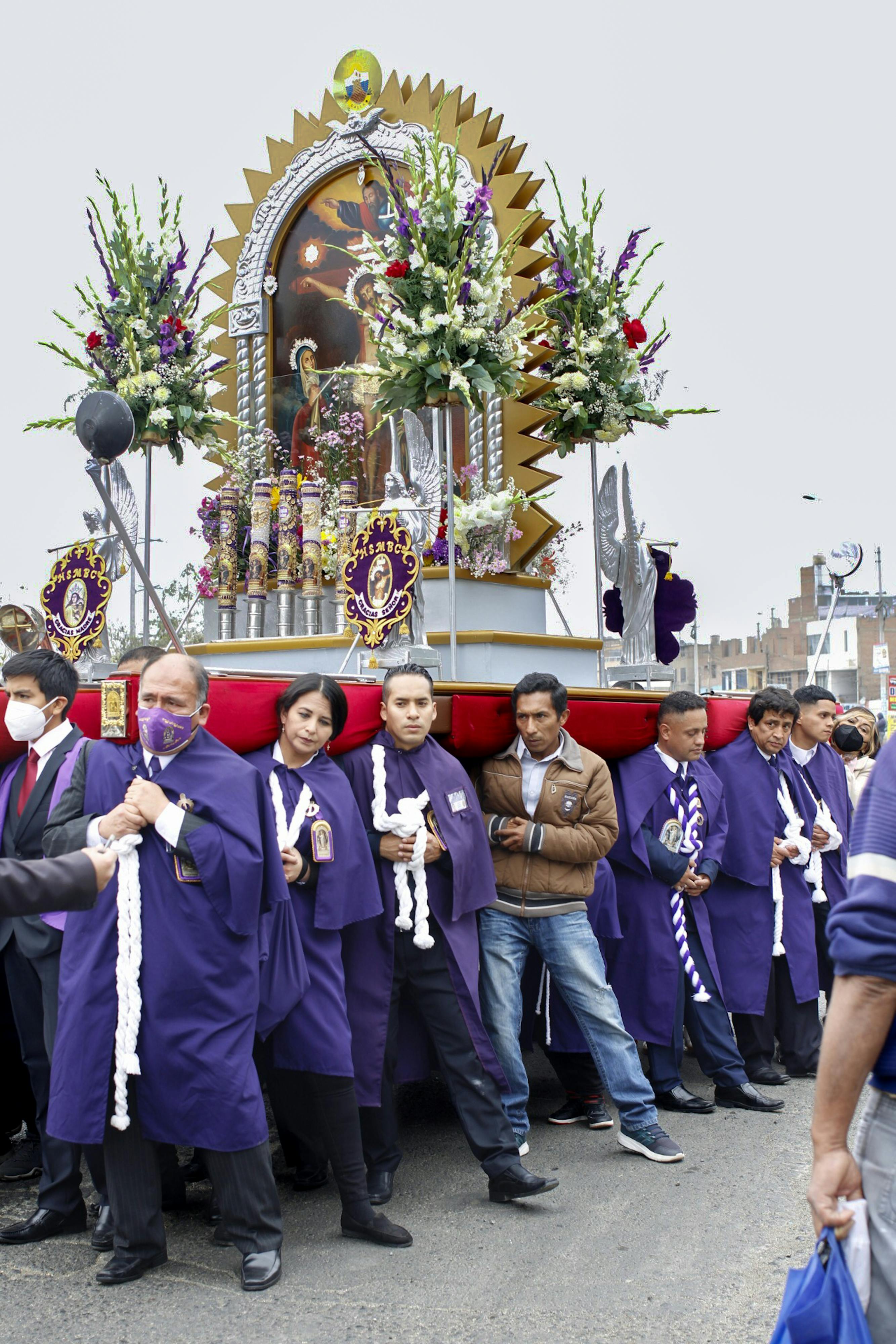 A Group of People Carrying a Religious Painting during a Procession ...