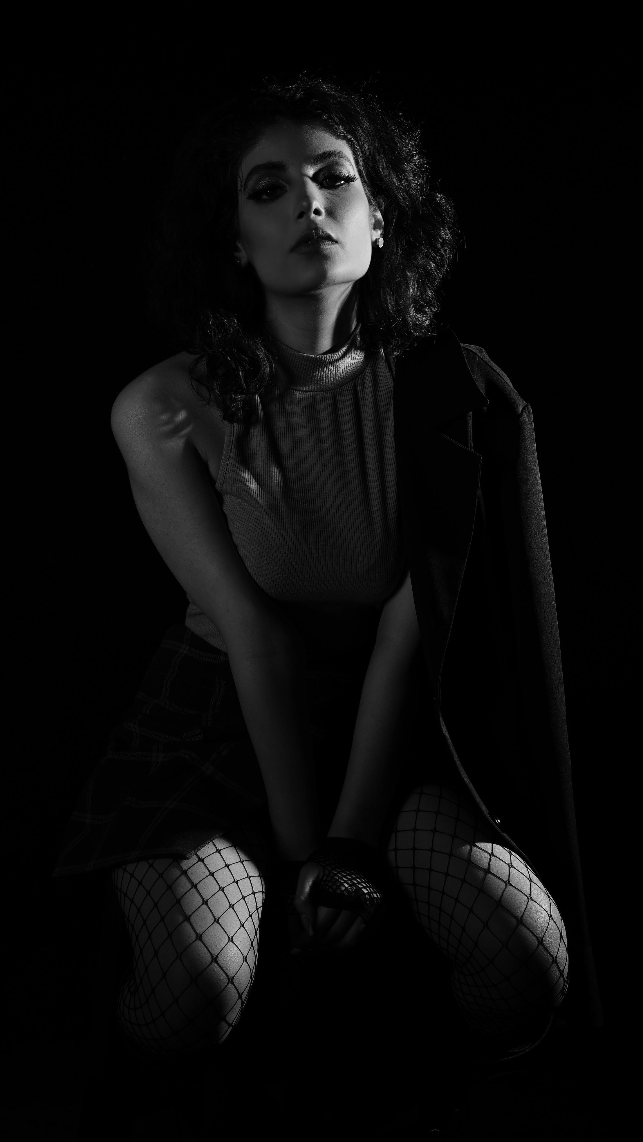 Black And White Photo Of Woman Wearing Leather Jacket Over Bra · Free