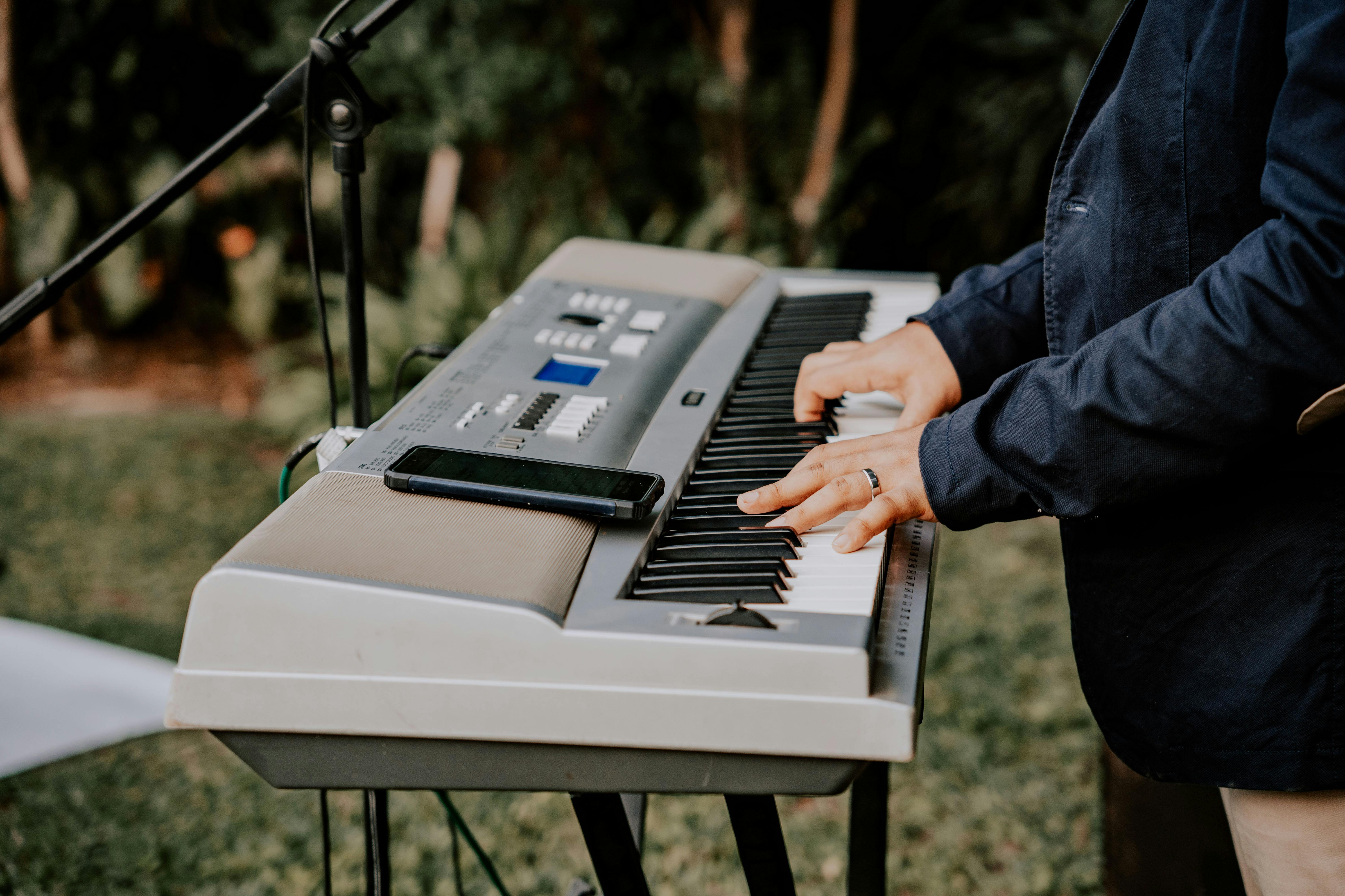 Hands of a Person Playing on Keyboard · Free Stock Photo