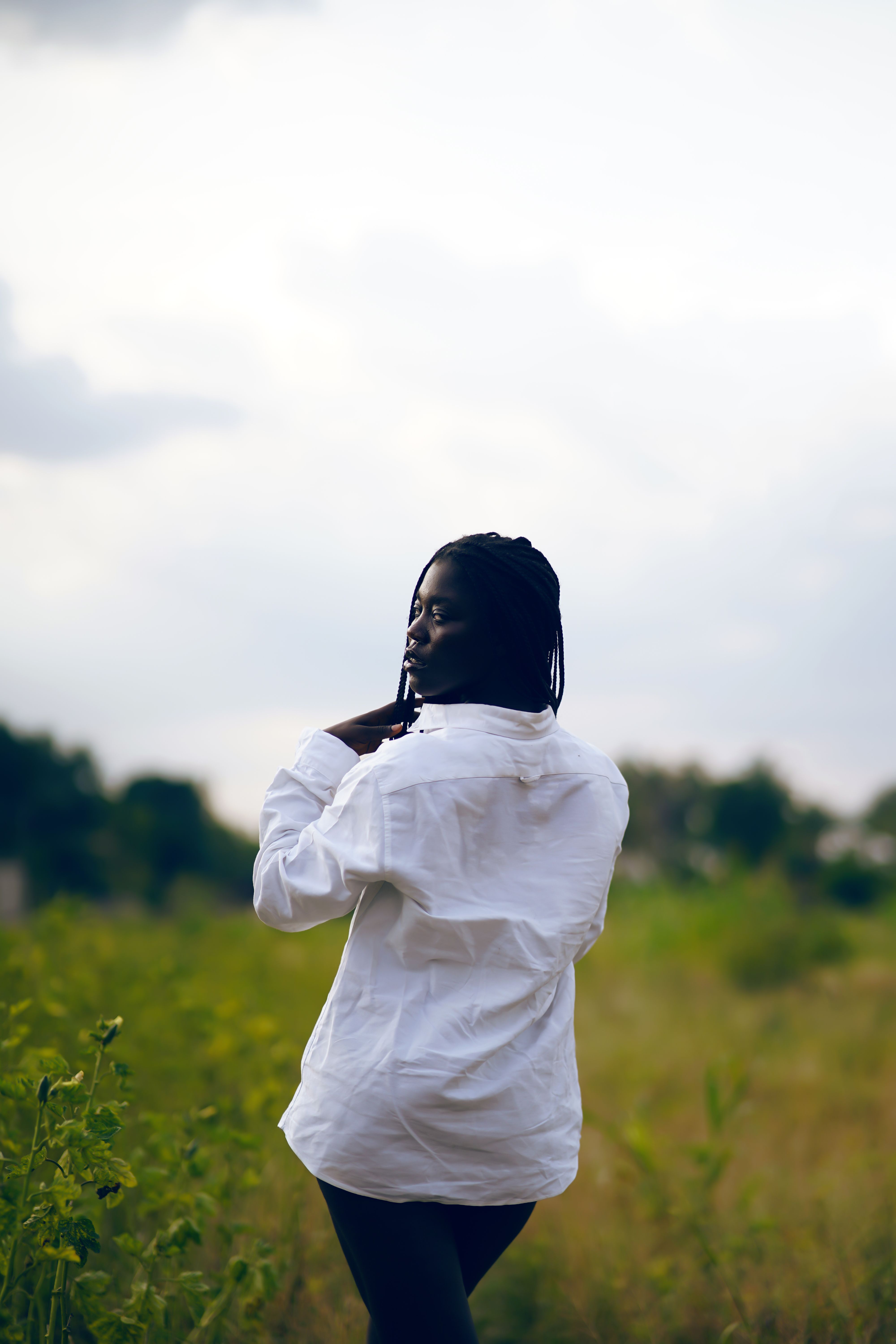 Back View of Woman Posing in White Shirt · Free Stock Photo
