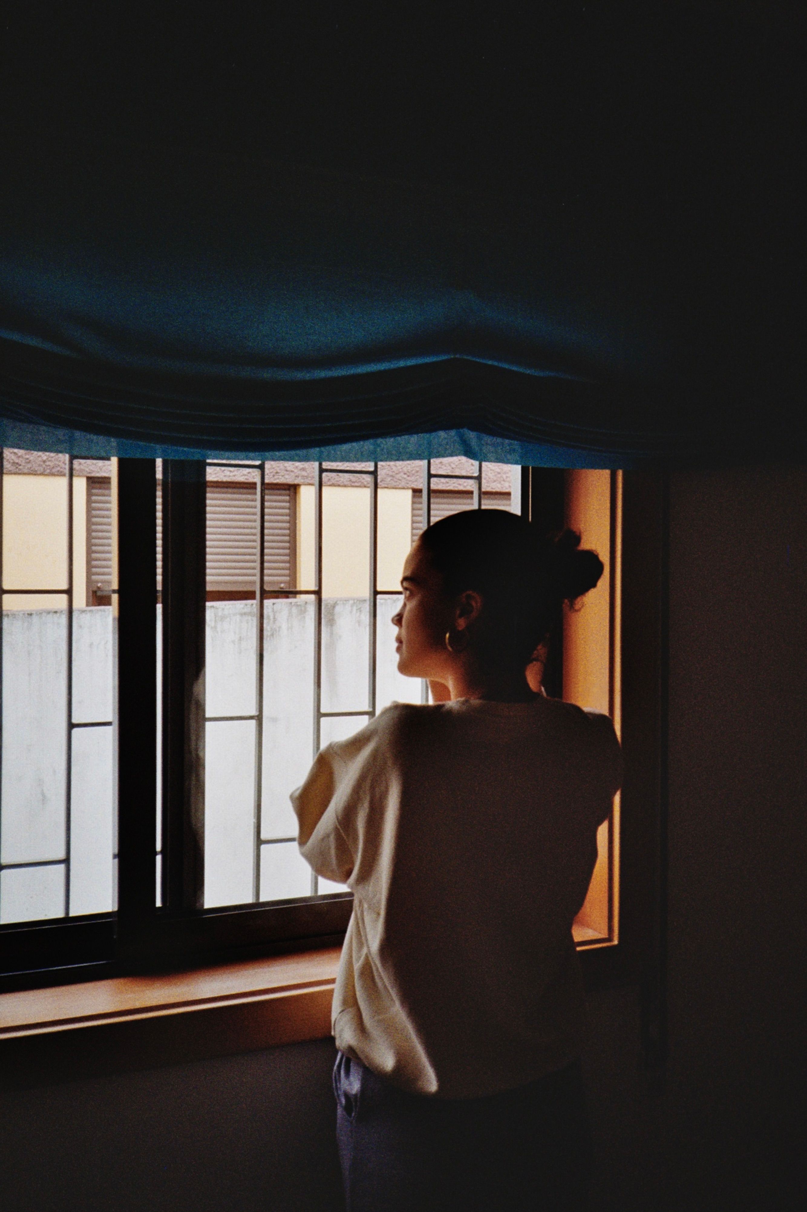Back View of Woman Standing by Windows · Free Stock Photo
