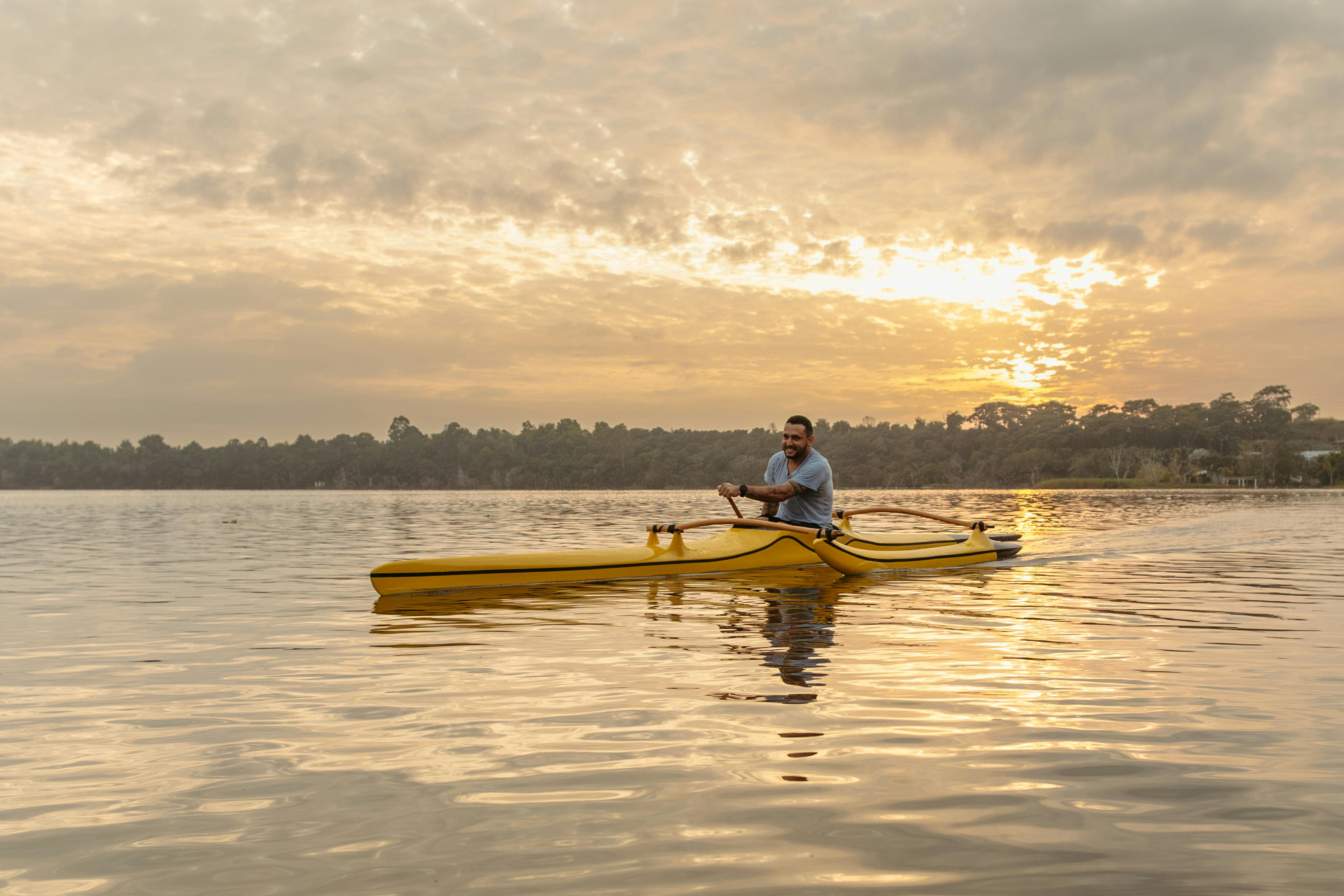 Man Kayaking at Sunrise · Free Stock Photo