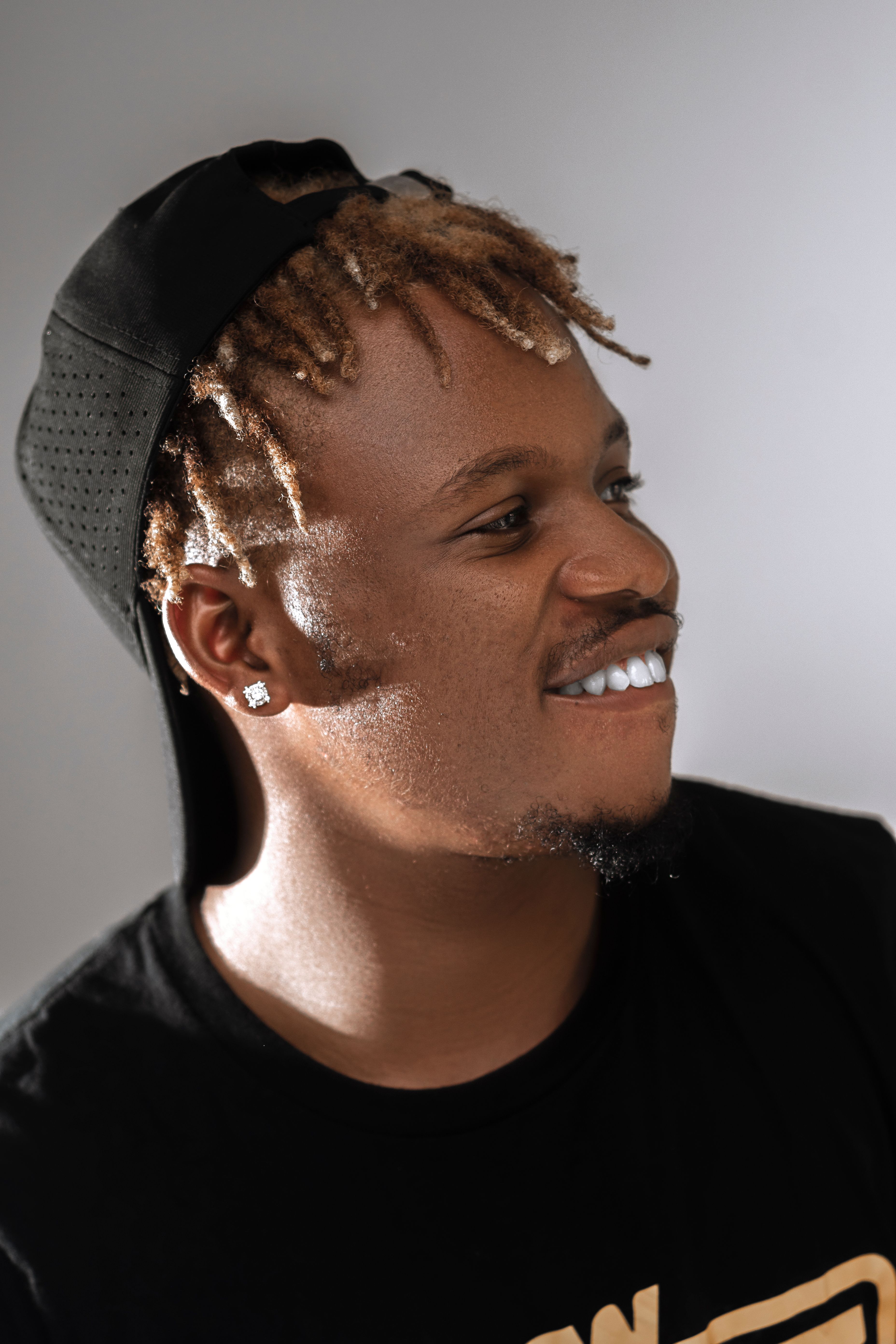 Young Man with Dreadlocks Wearing a Cap · Free Stock Photo