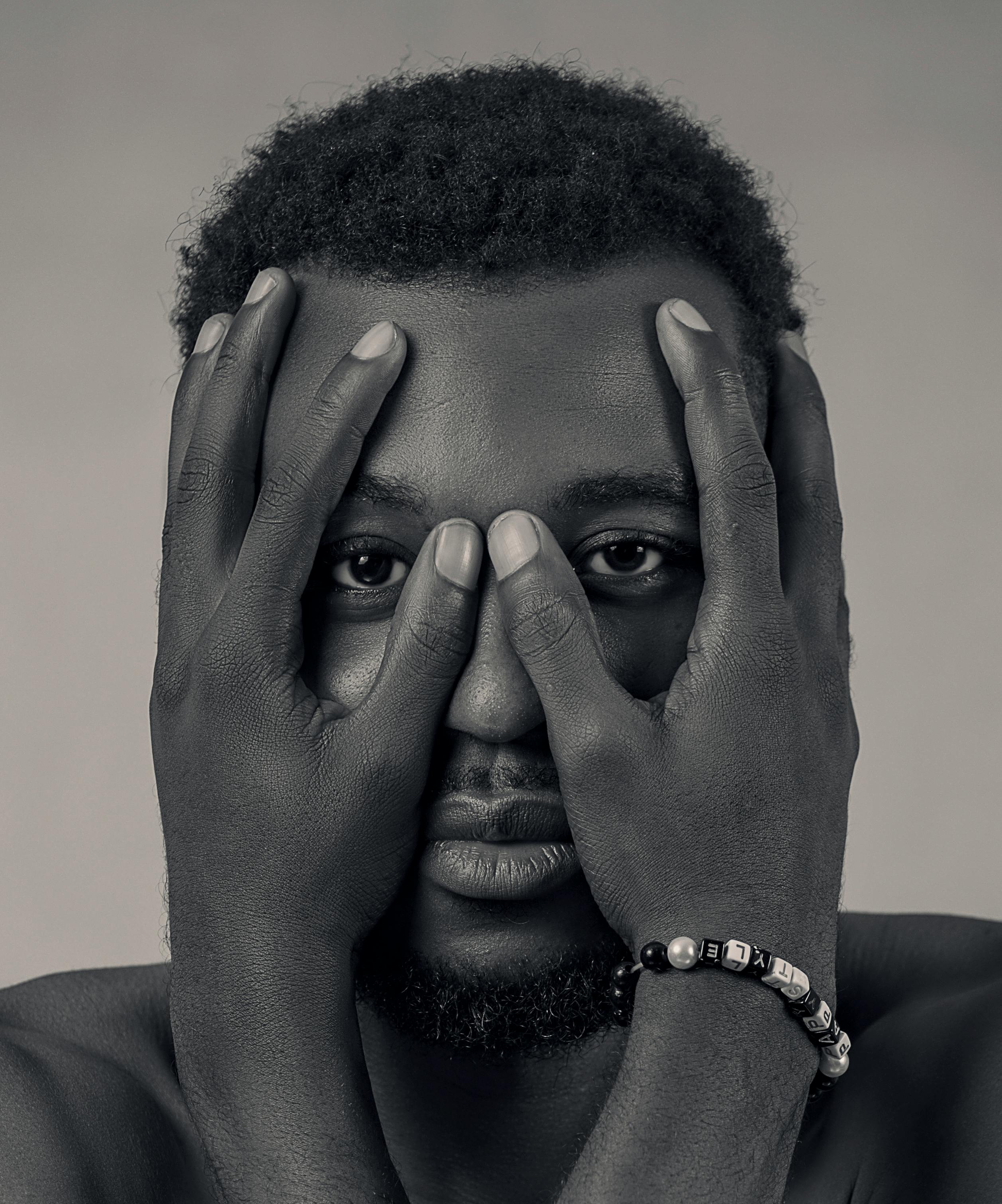 Man Posing with Hands on Face · Free Stock Photo