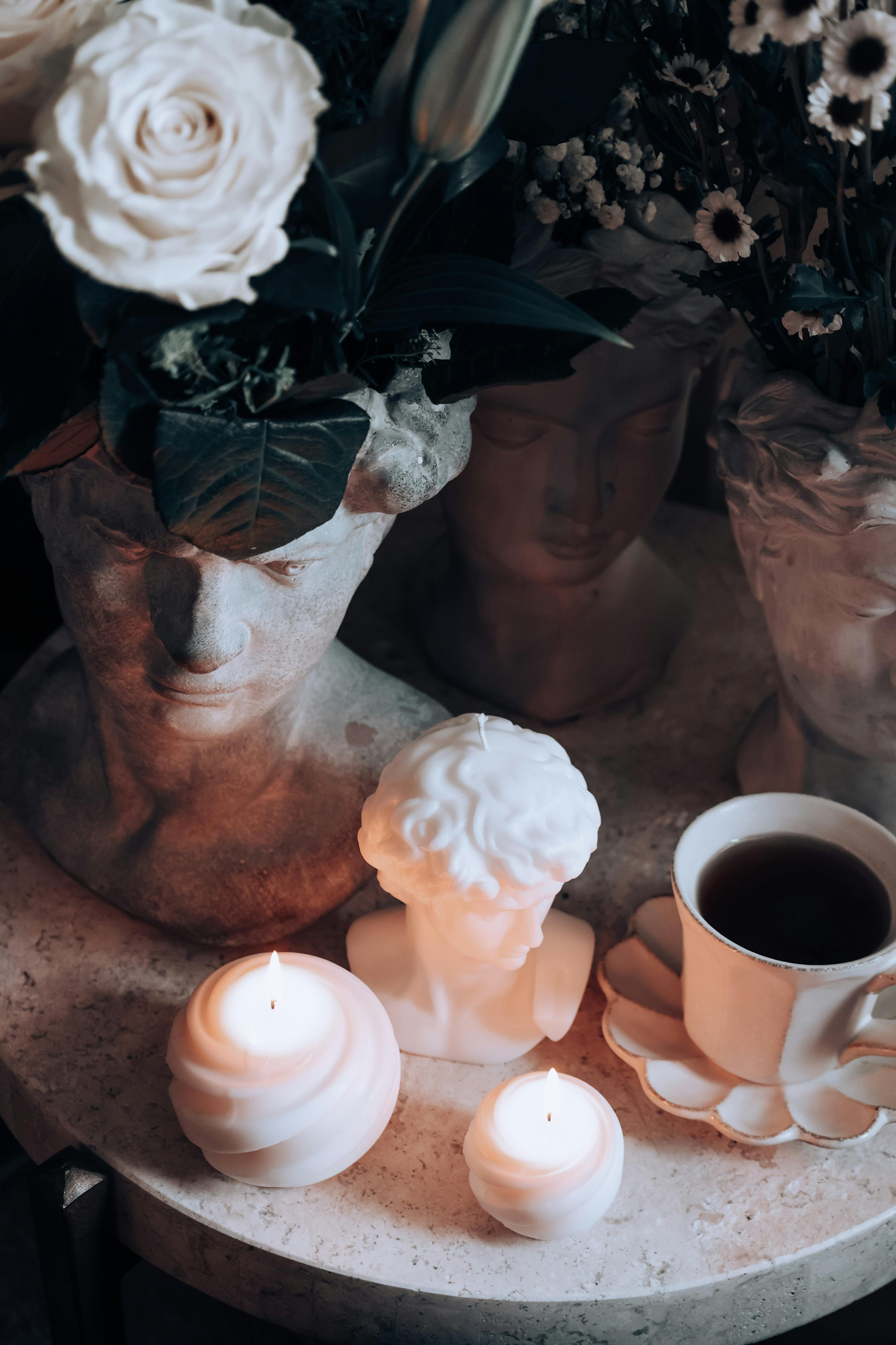 Cup of Tea, Candles and Bust Flower Vases · Free Stock Photo