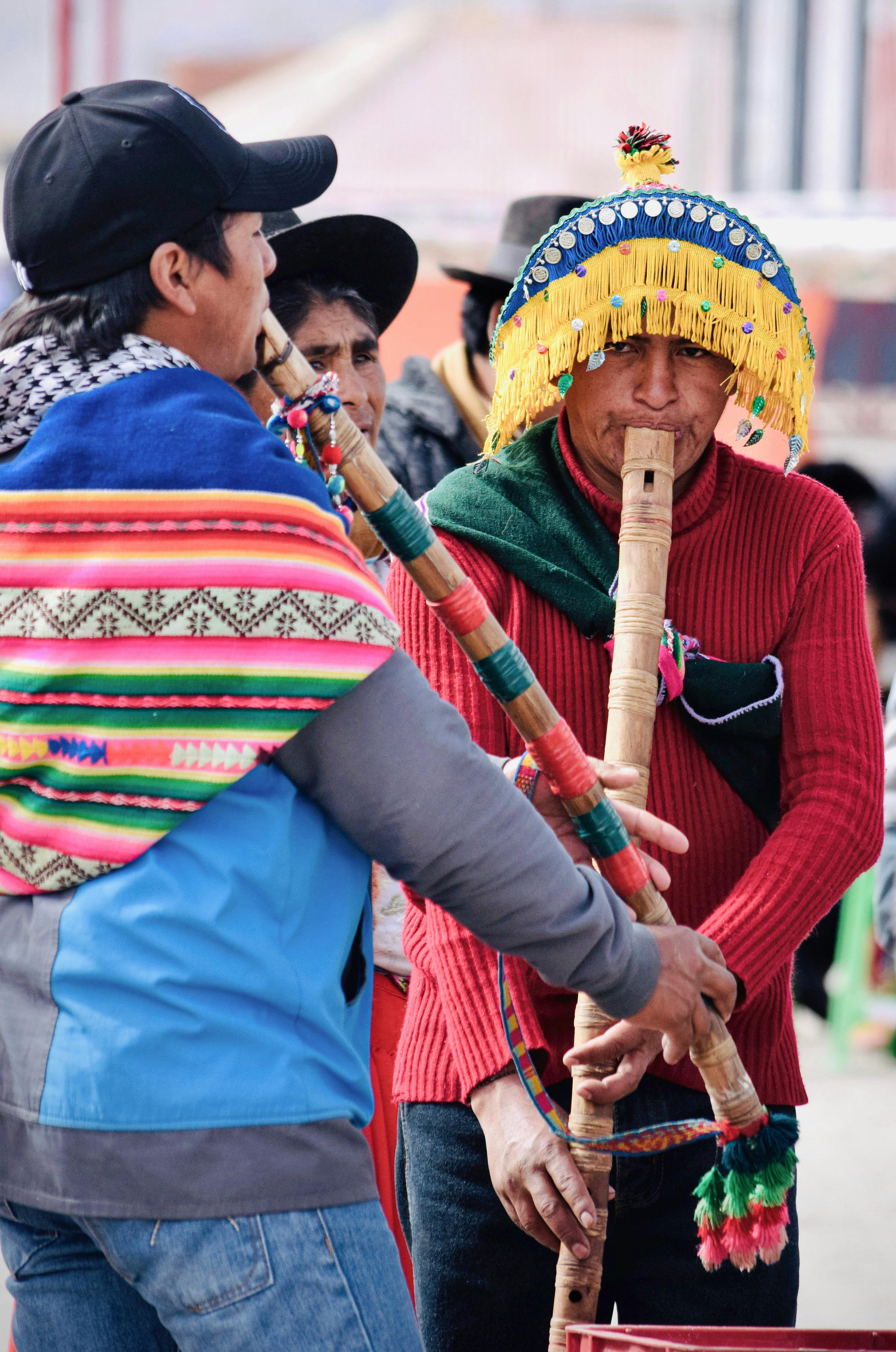 Men in Traditional Clothing Playing Traditional Musical Instruments ...