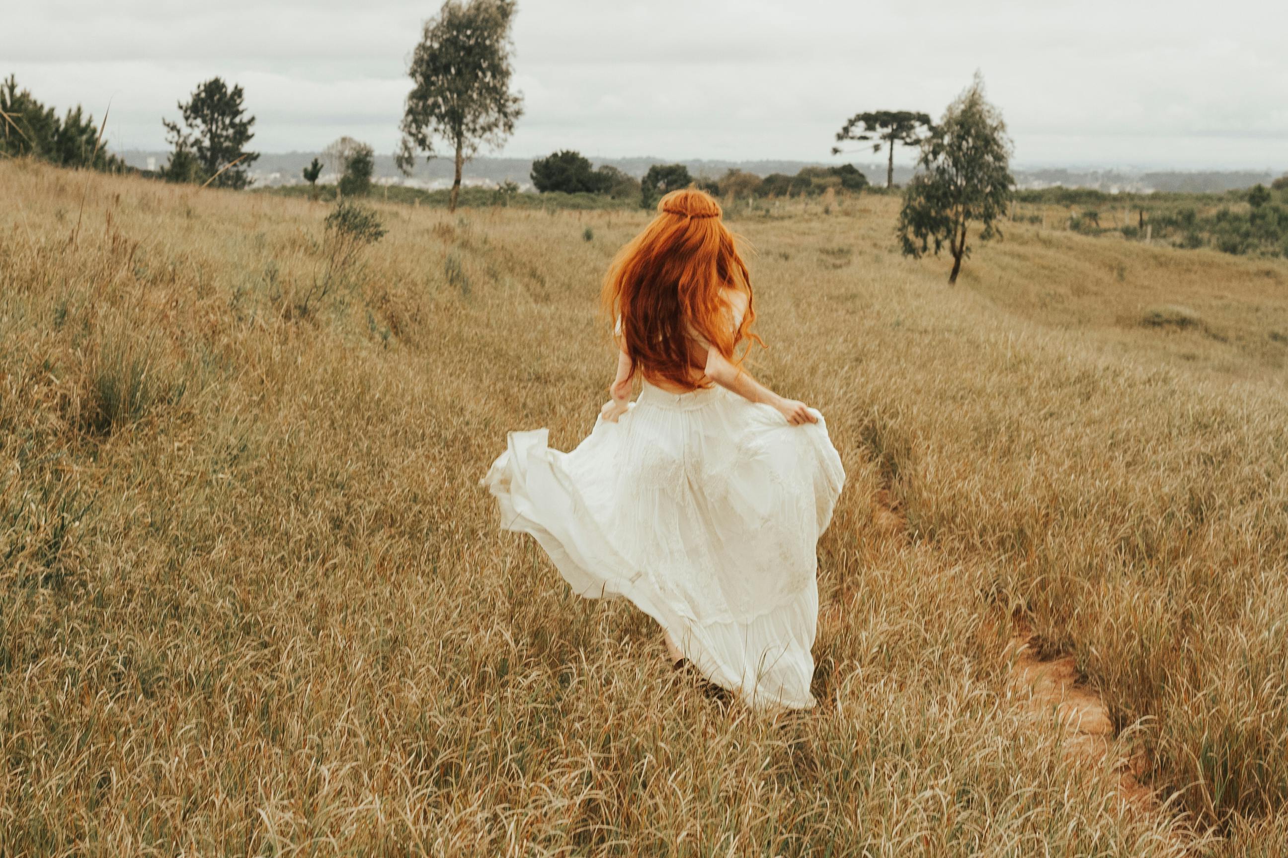 Women in White Dress Running on Field · Free Stock Photo