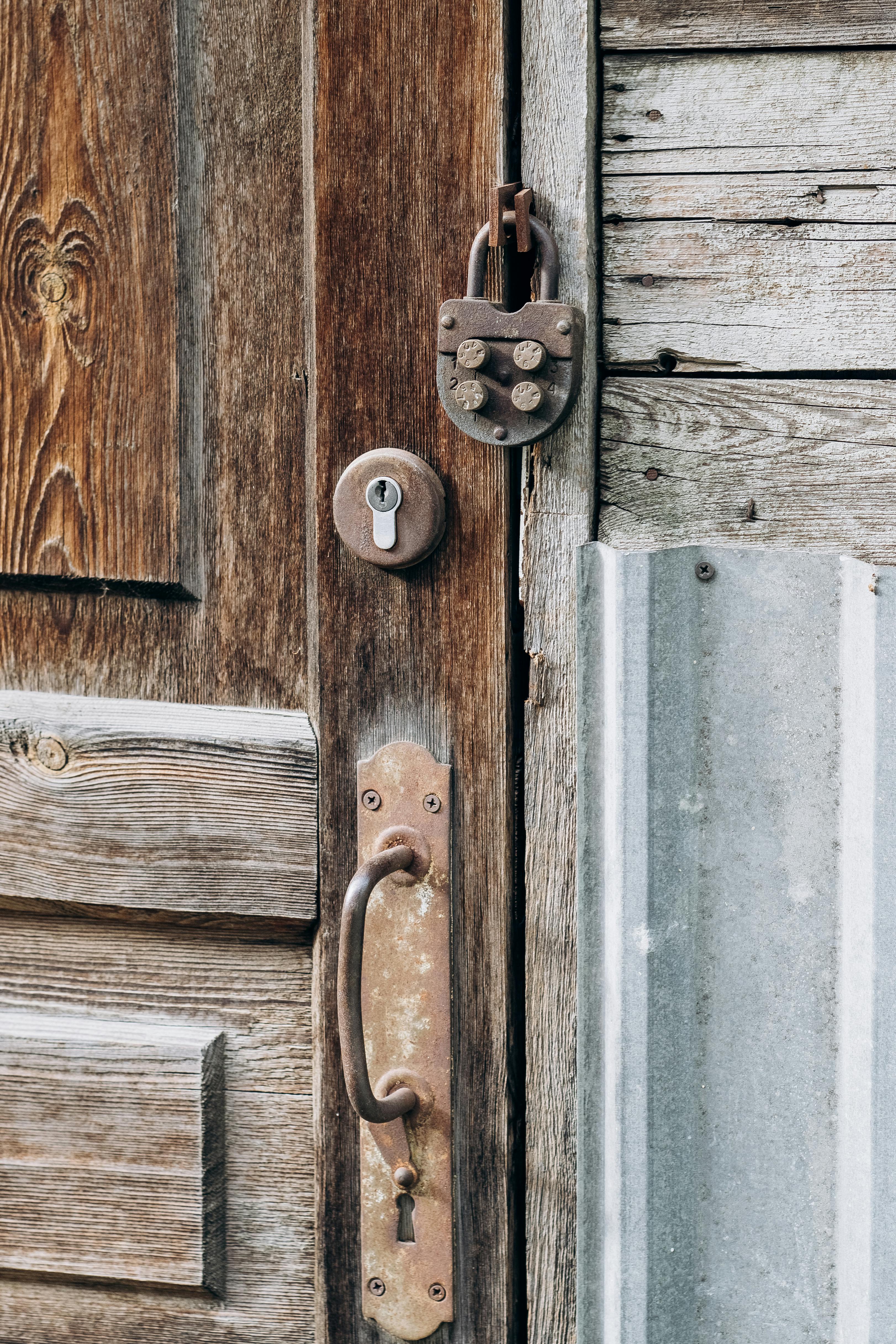 Close-Up Shot of a Locked Wooden Door · Free Stock Photo