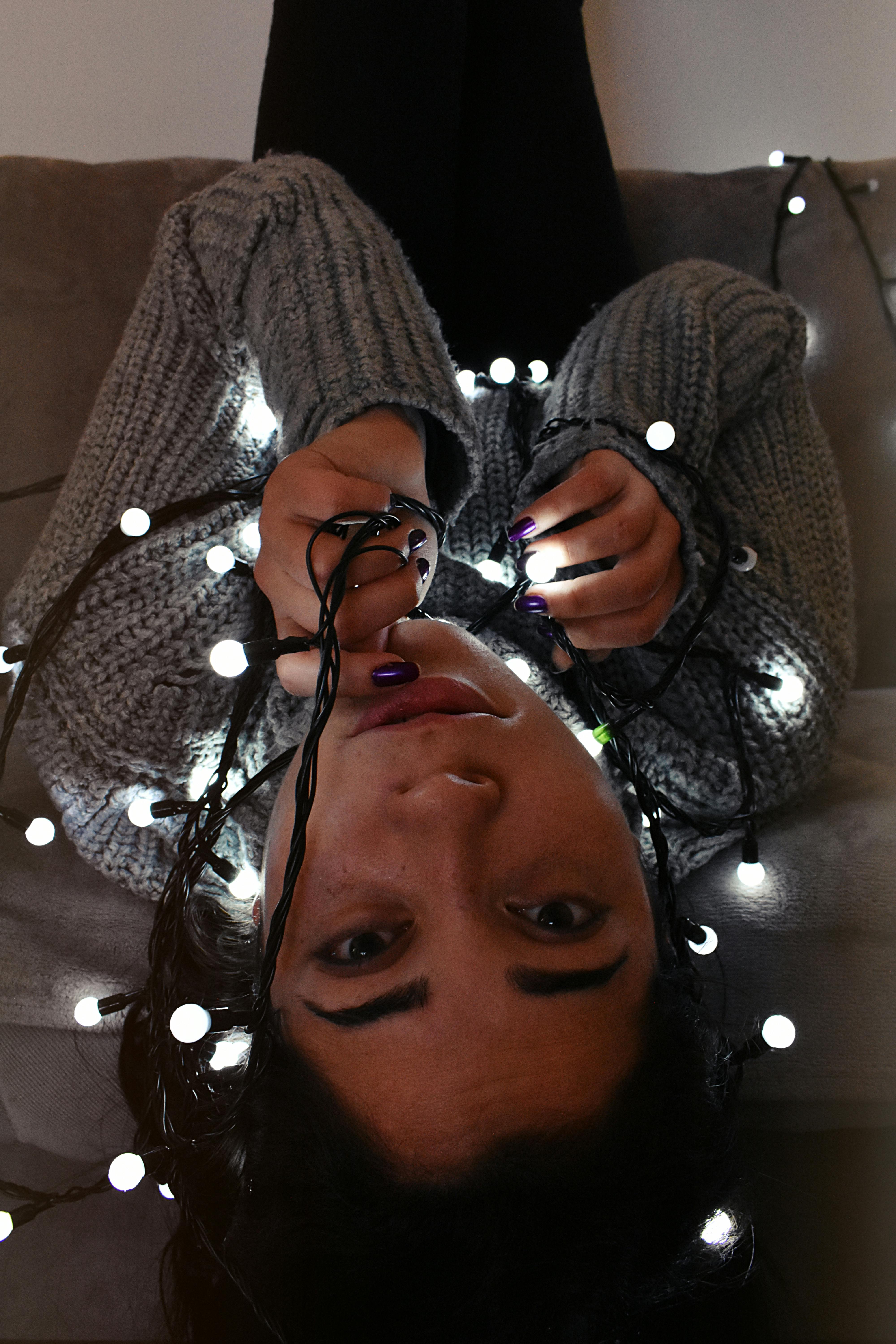 Woman Holding String Lights · Free Stock Photo