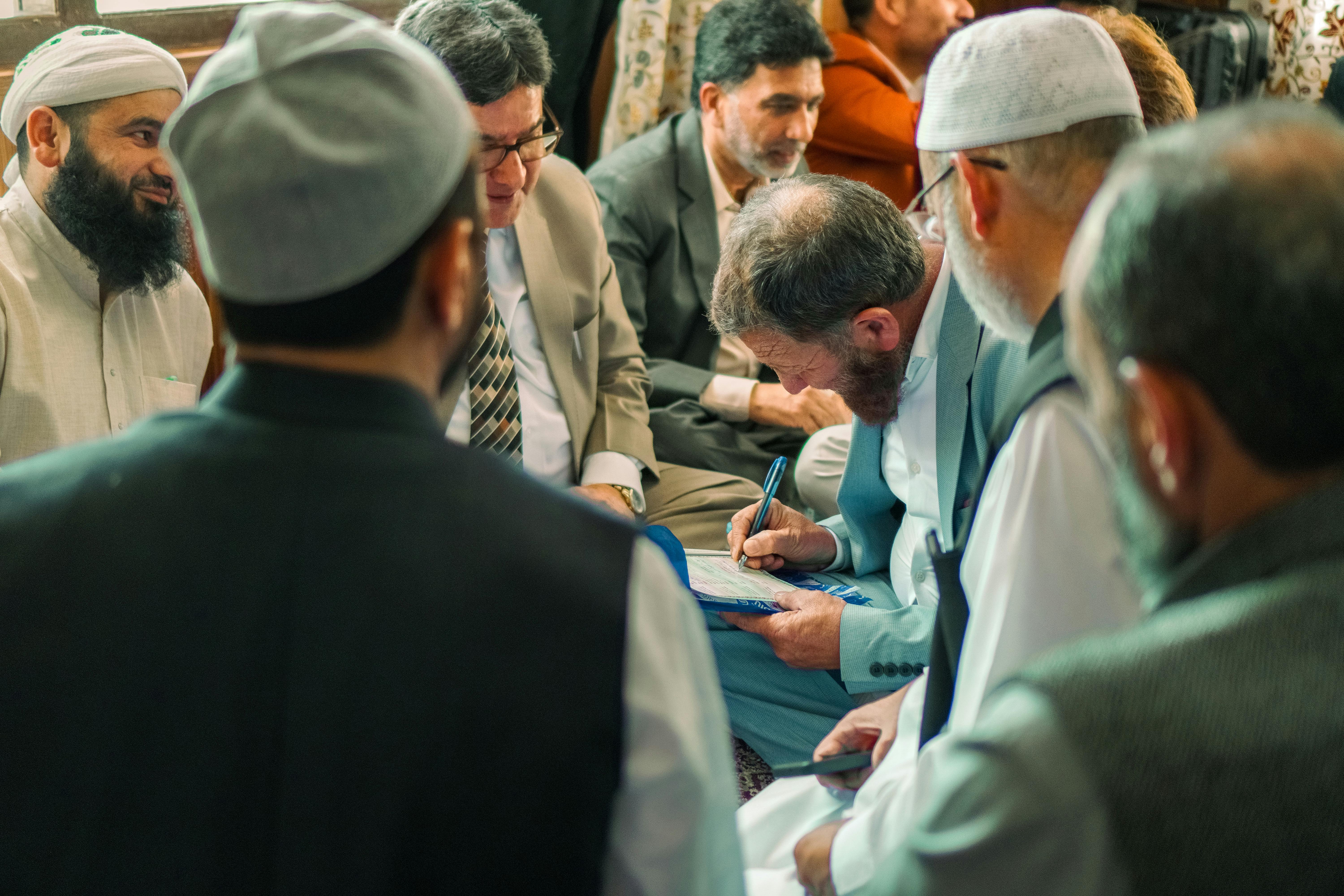 Man Signing Form · Free Stock Photo