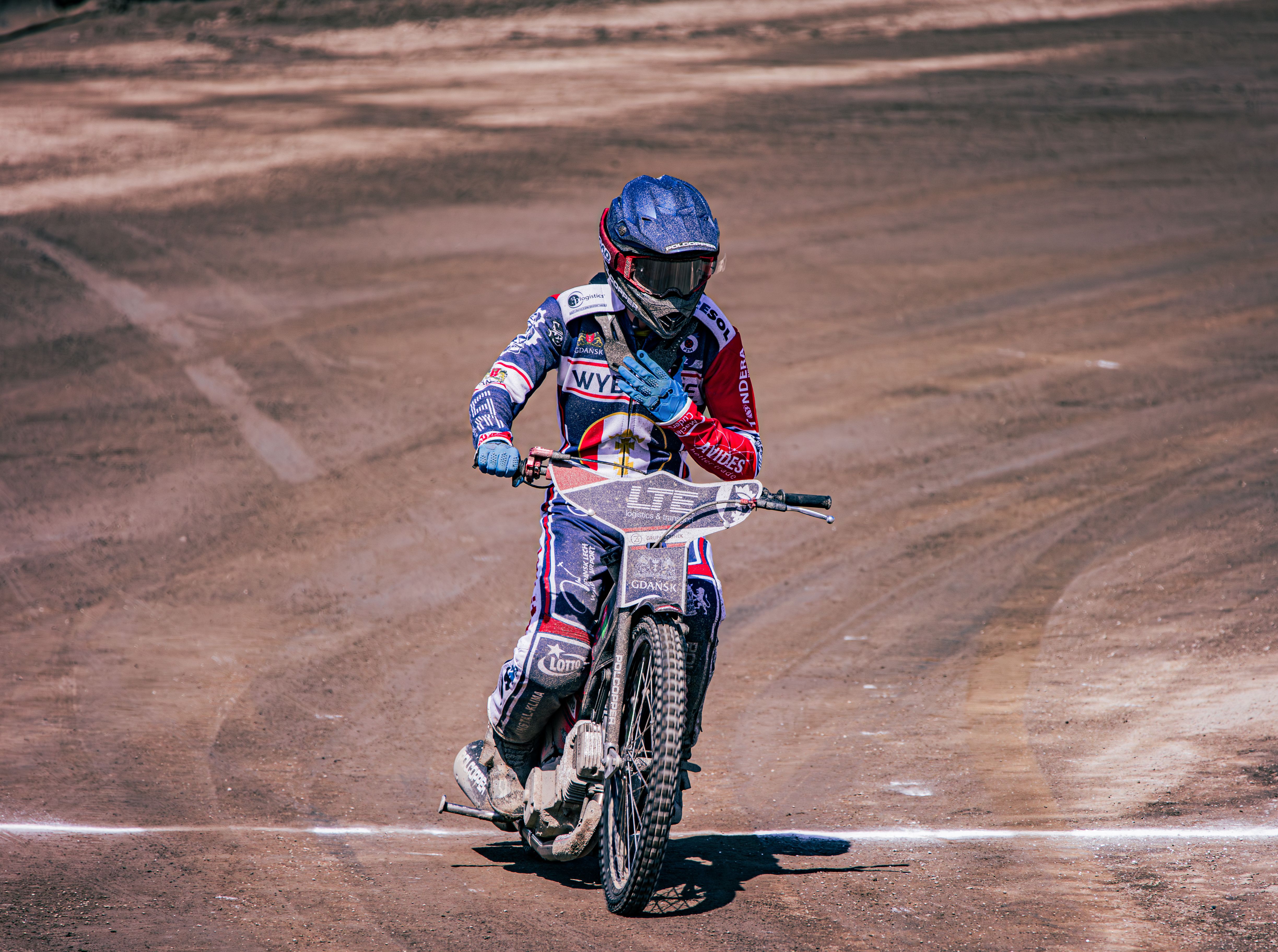 Man Riding Motocross Dirt Bike on Dirt Road · Free Stock Photo