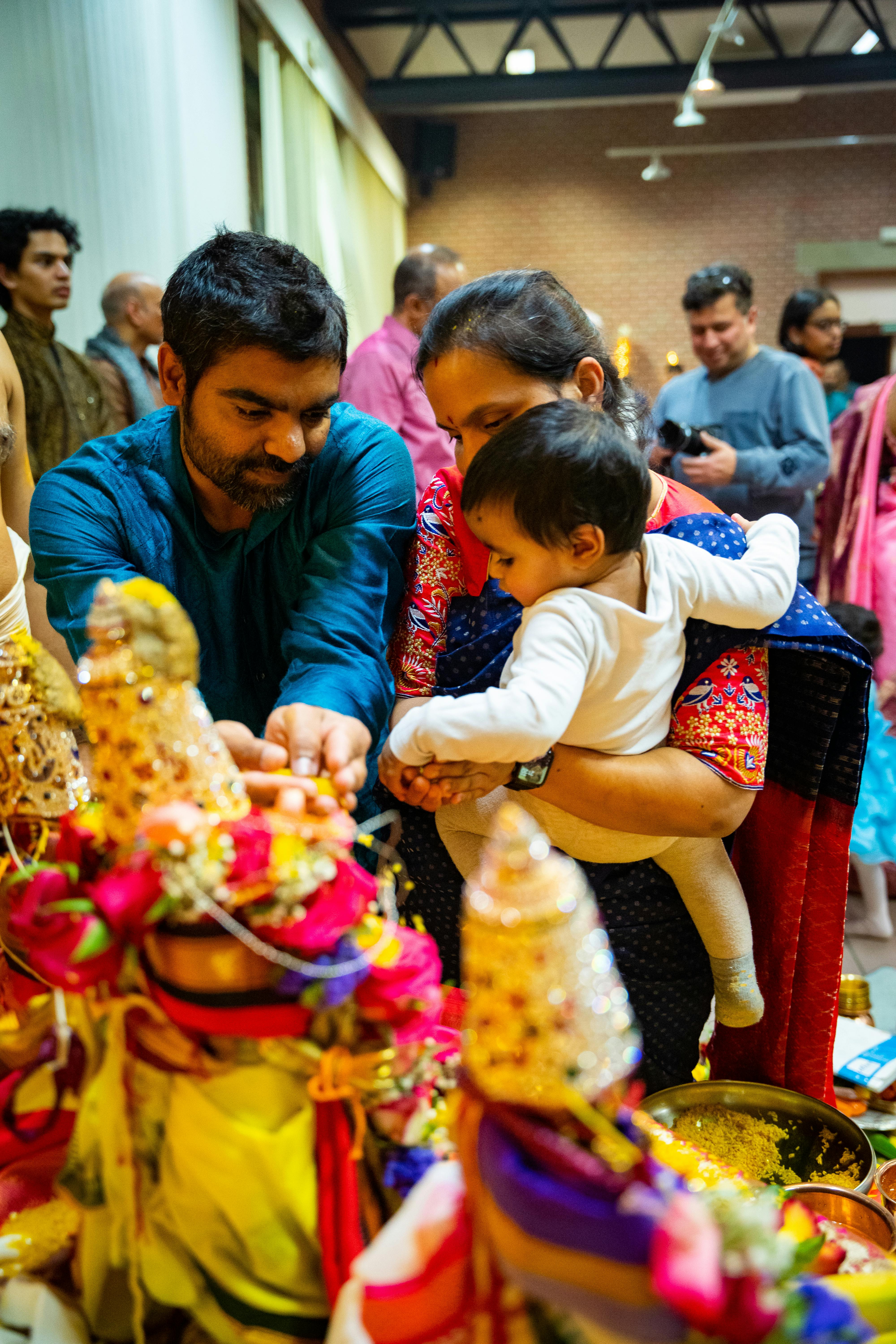 Family with a Child during a Traditional Festival · Free Stock Photo