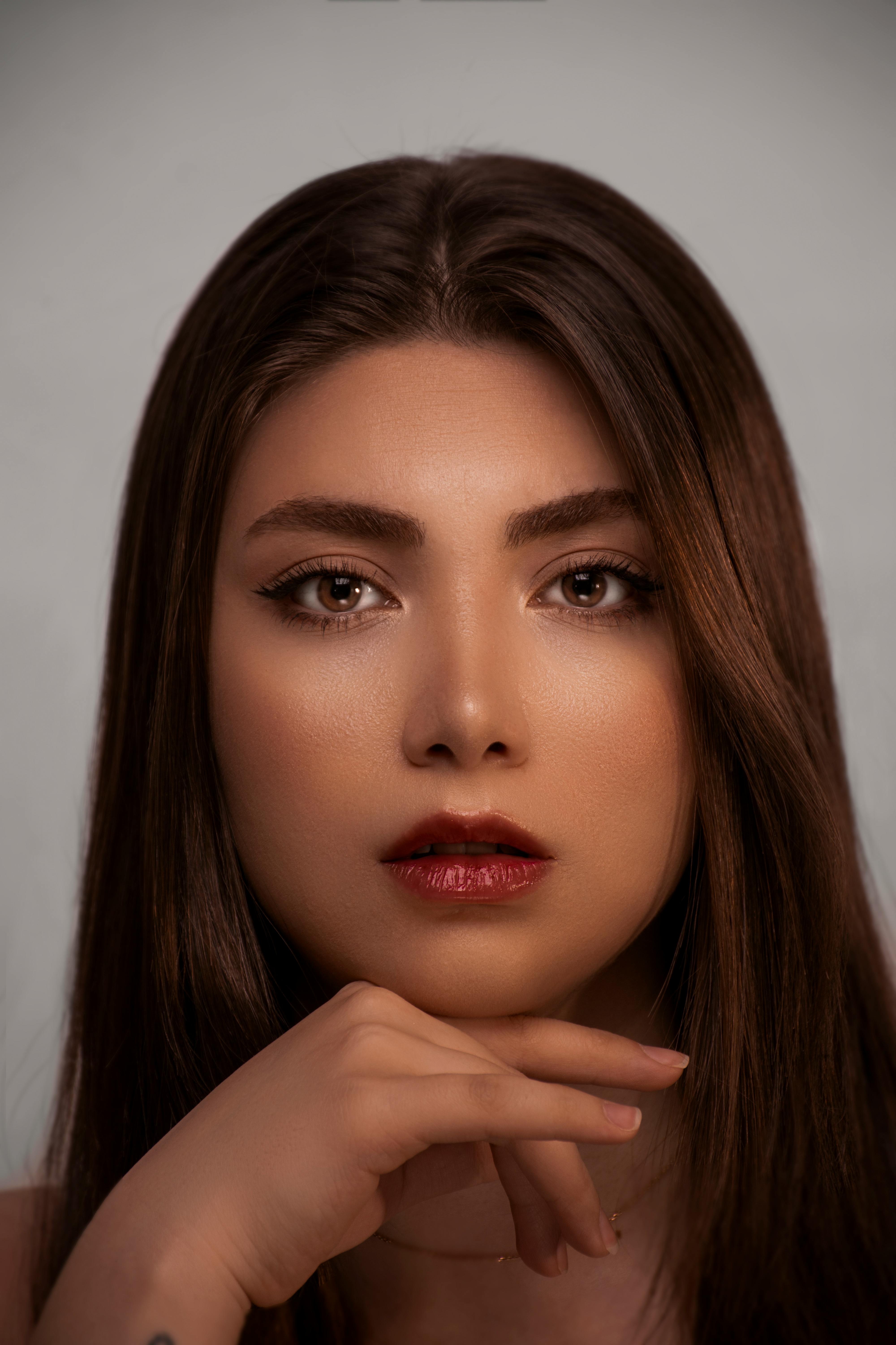 Portrait of Woman Against Black Background · Free Stock Photo