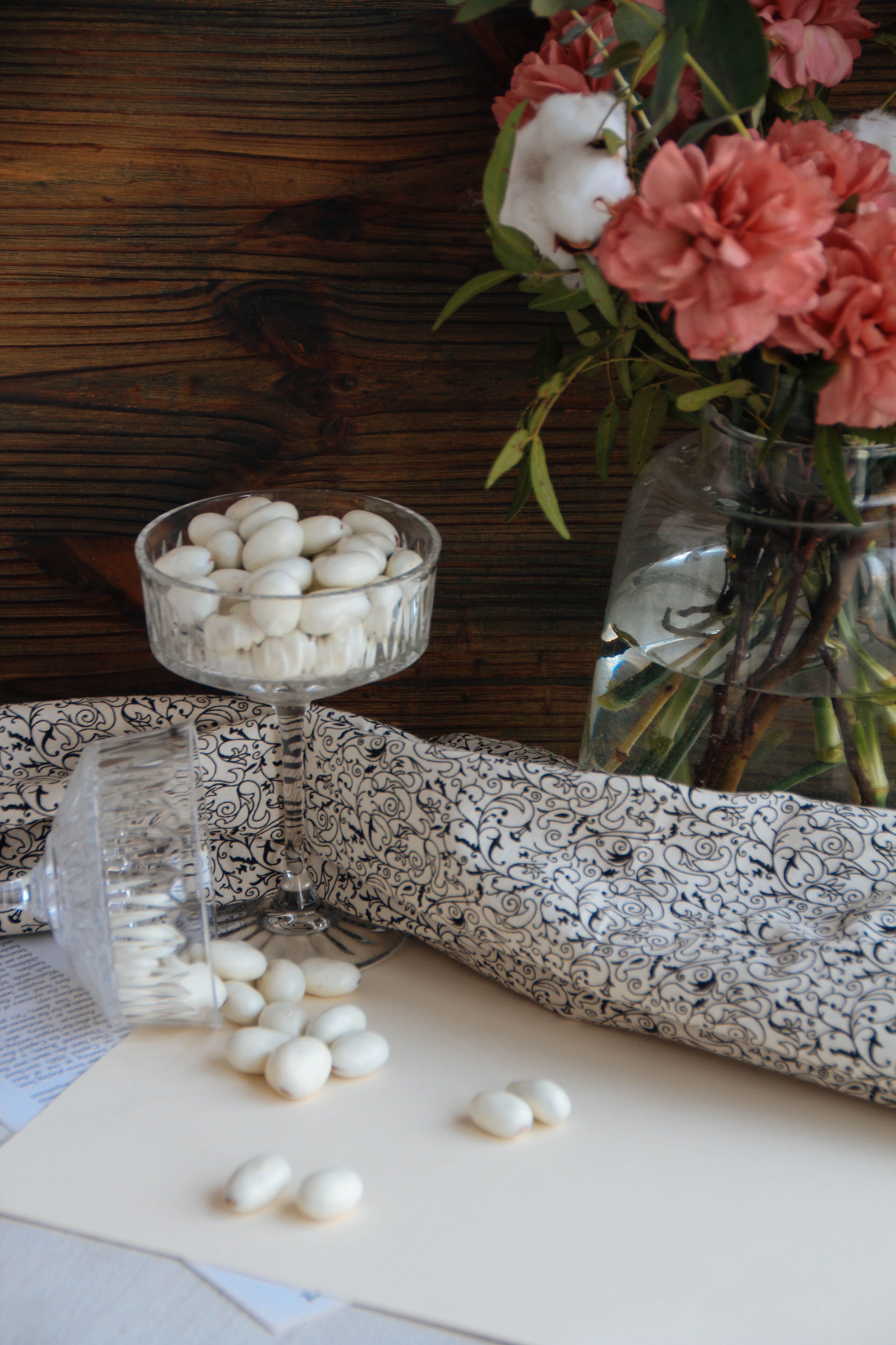 White Chocolate Beans near Flowers · Free Stock Photo