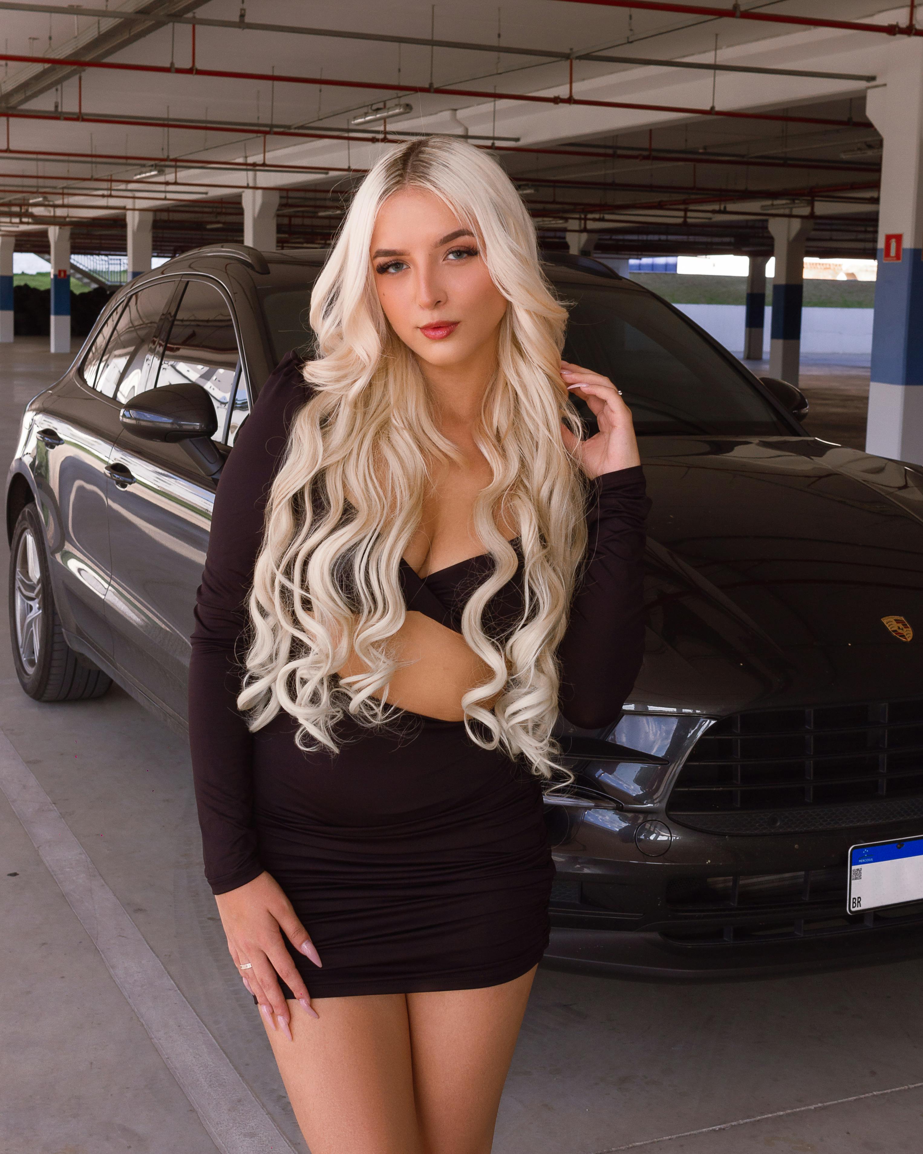 Young Woman in a Black Crop Top and Mini Skirt Next to the Car in the Parking Garage · Free ...