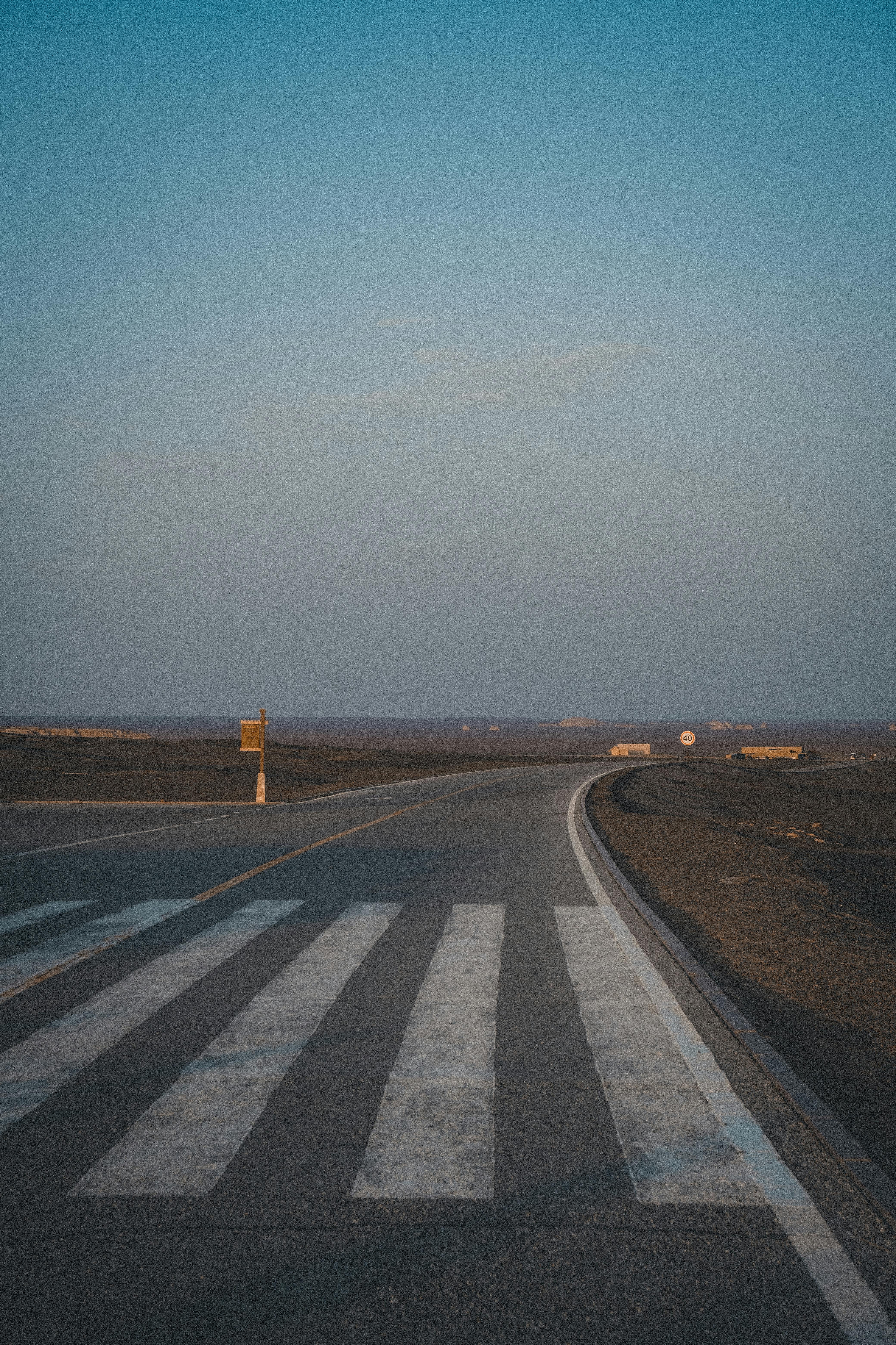 Crosswalk and a Turn on an Empty Road Through the Countryside · Free ...