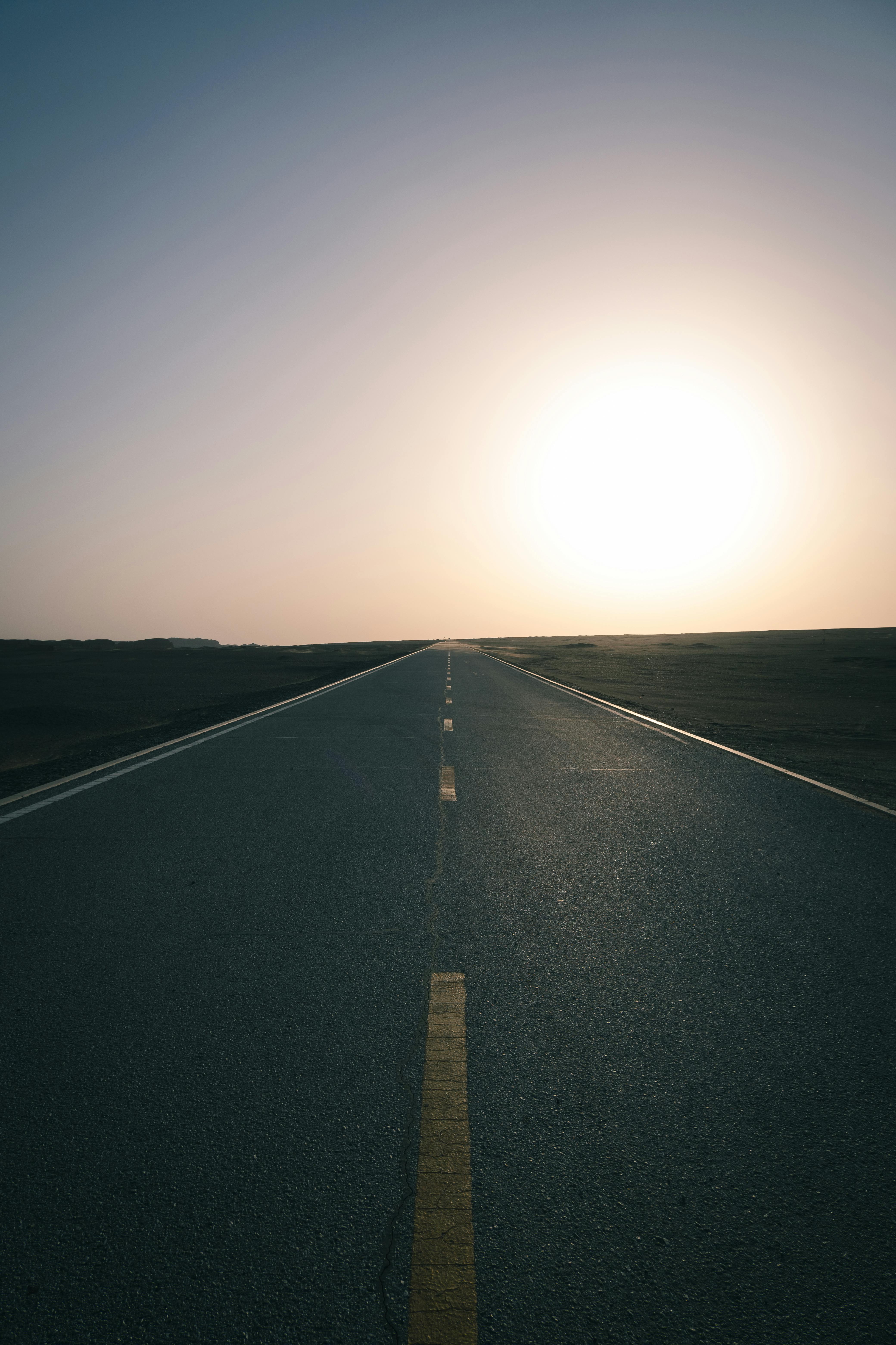 Sun over Empty Road at Sunset · Free Stock Photo