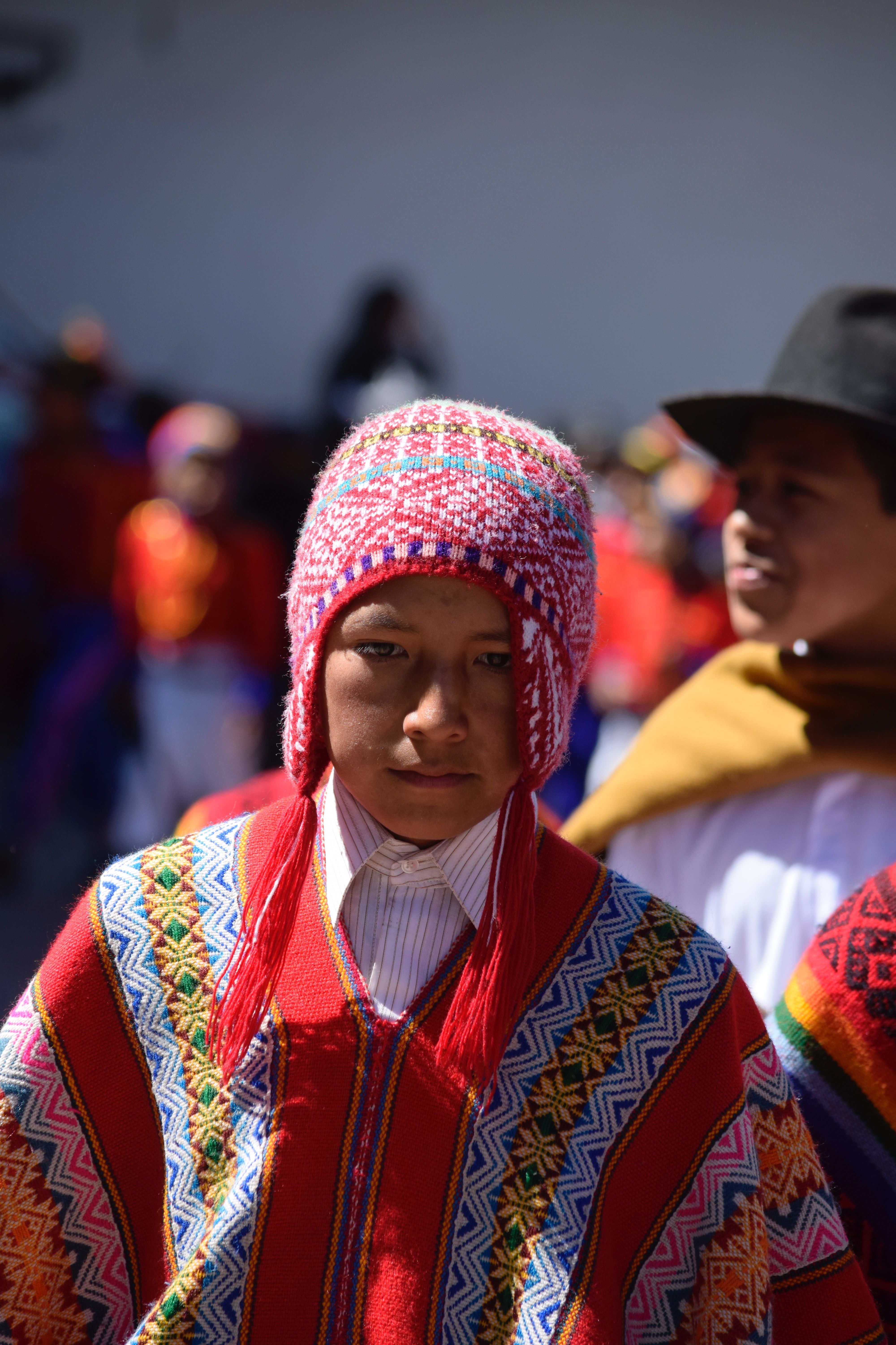 Teenager in Traditional Embroidered Poncho and Chullo Hat · Free Stock ...
