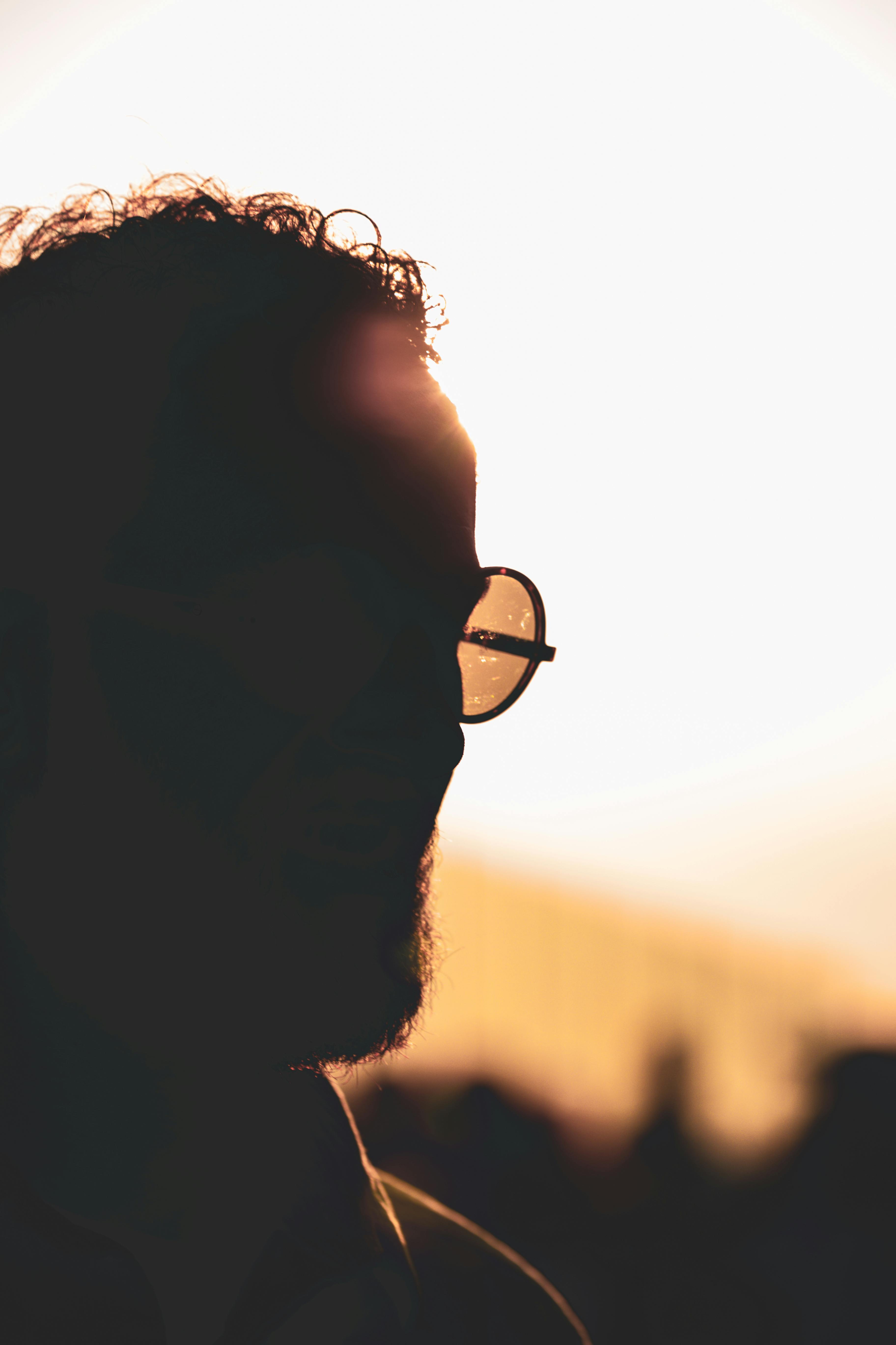 Silhouette of a Face in the Golden Sunset · Free Stock Photo