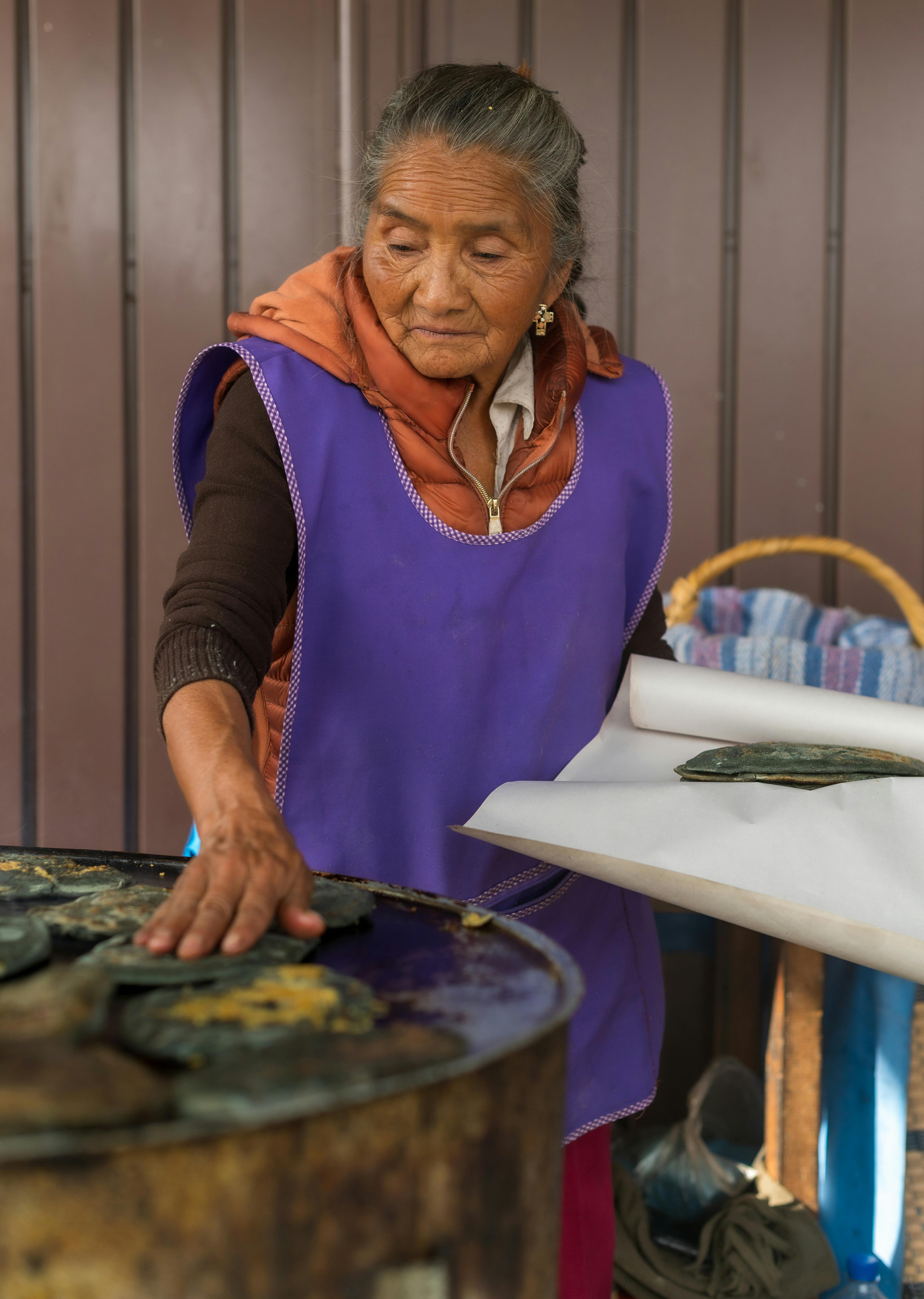 A Woman Making Traditional Food · Free Stock Photo