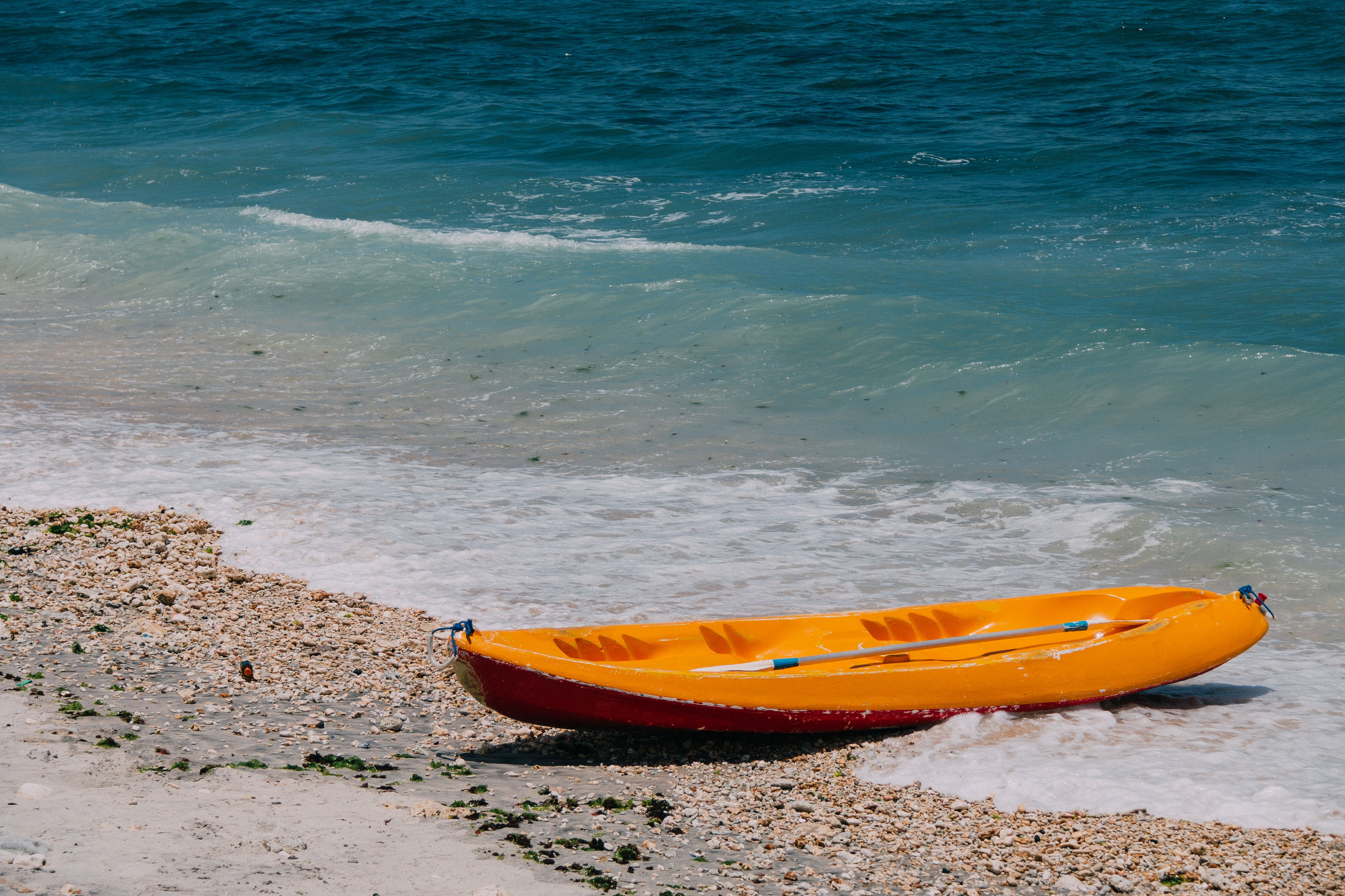 Canoe Lying on Beach · Free Stock Photo