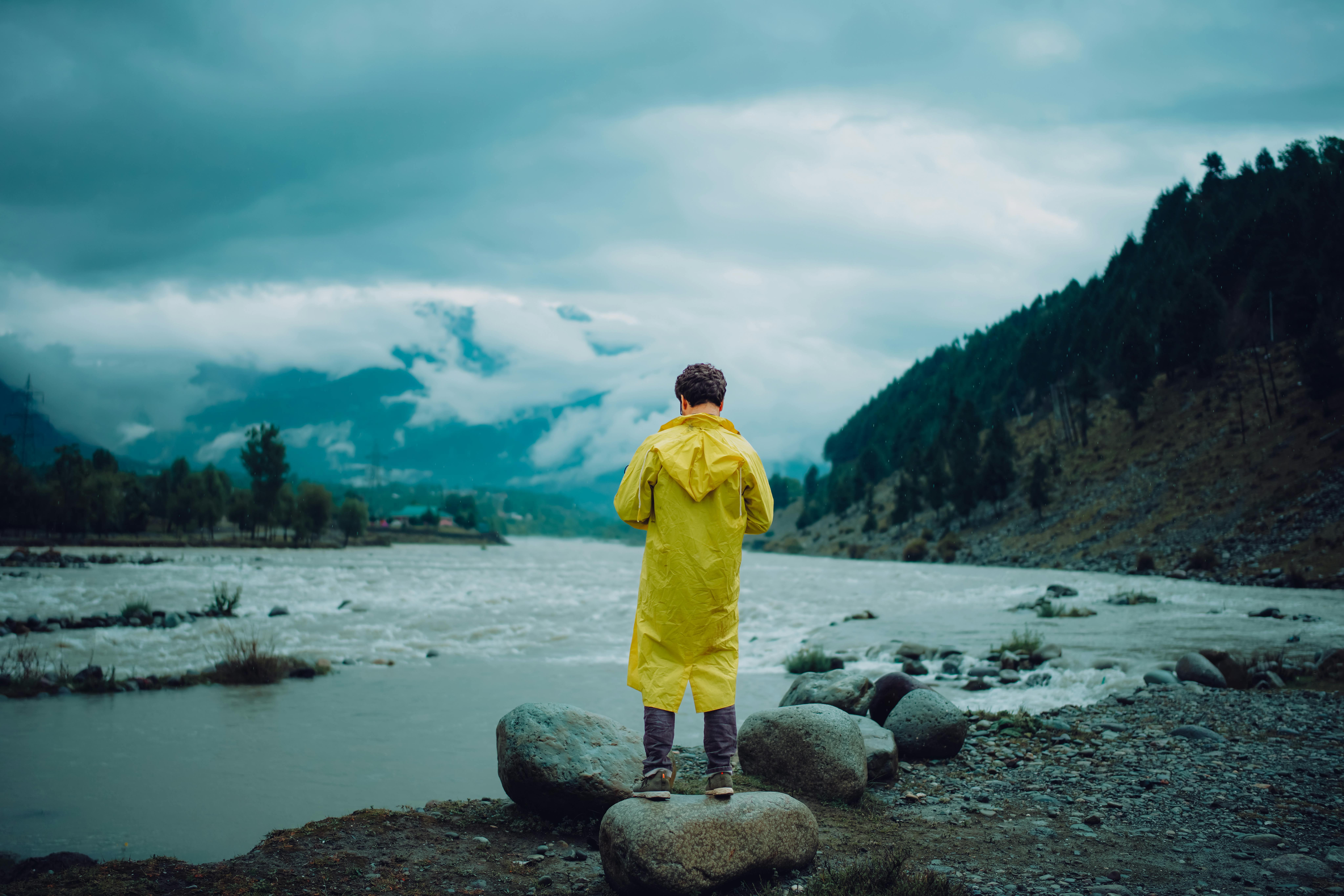 Woman Walking Near Body of Water · Free Stock Photo
