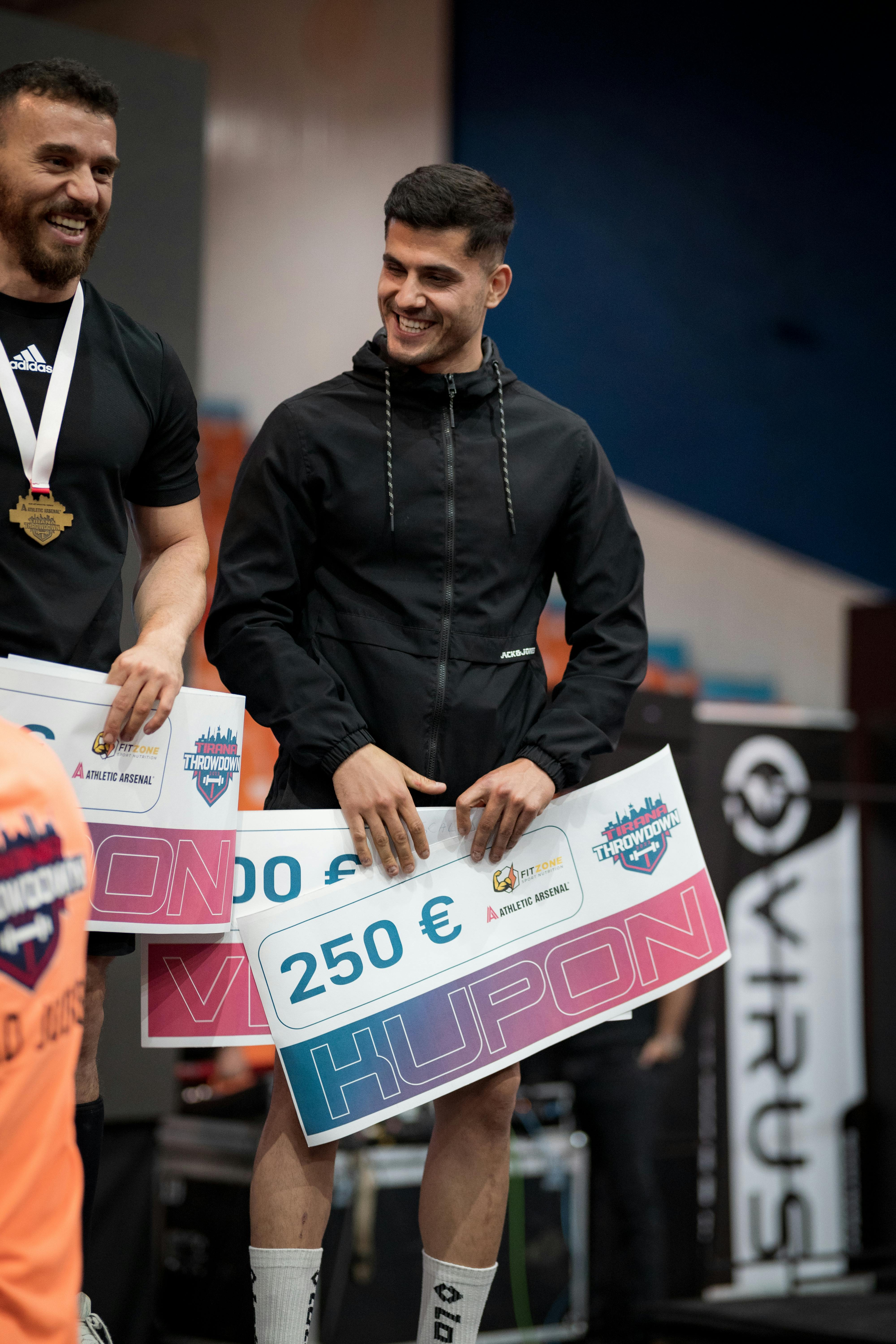 Men Posing with Prizes after Competition · Free Stock Photo