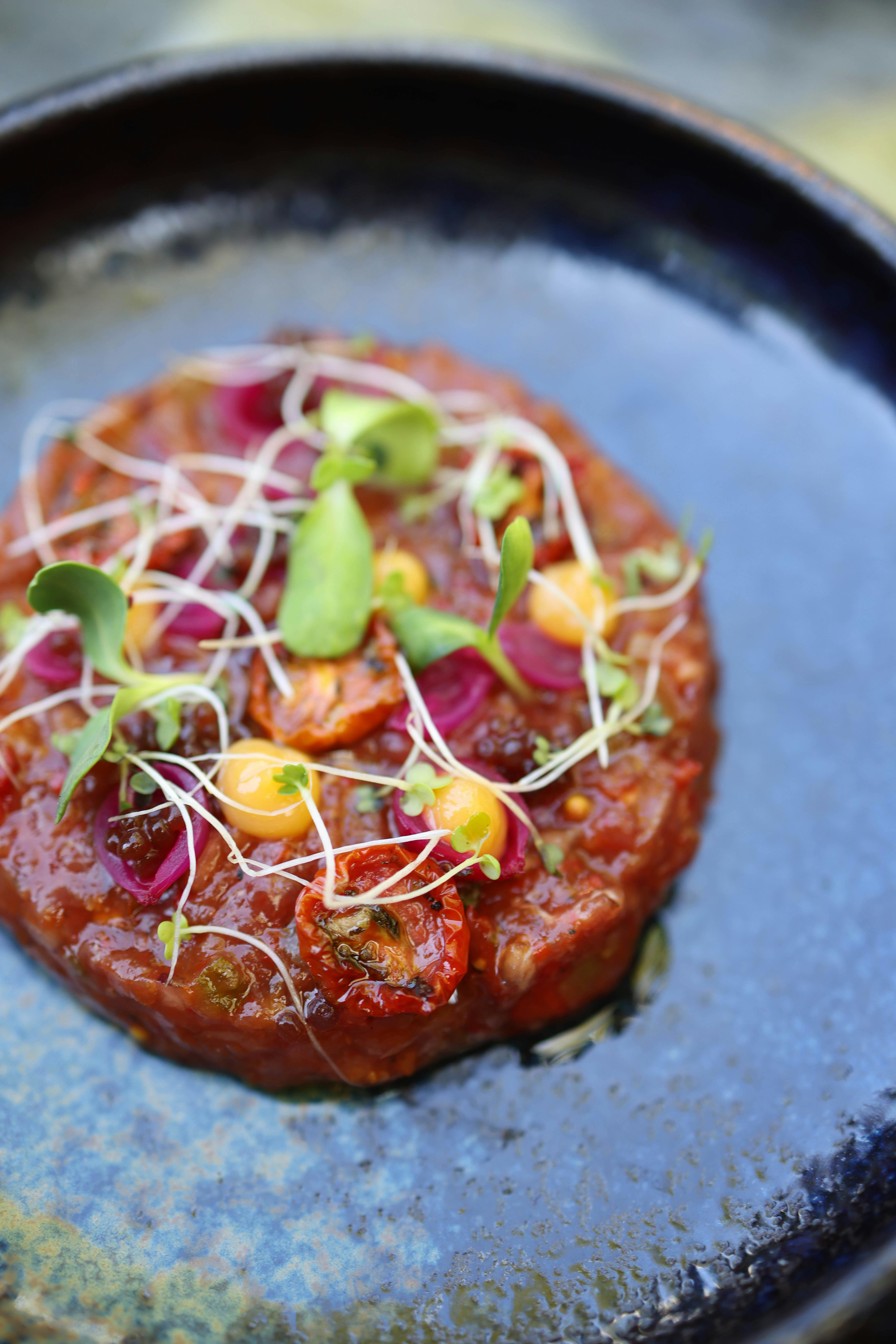 Beef Patty Served with Roasted Tomatoes and Sprouts · Free Stock Photo