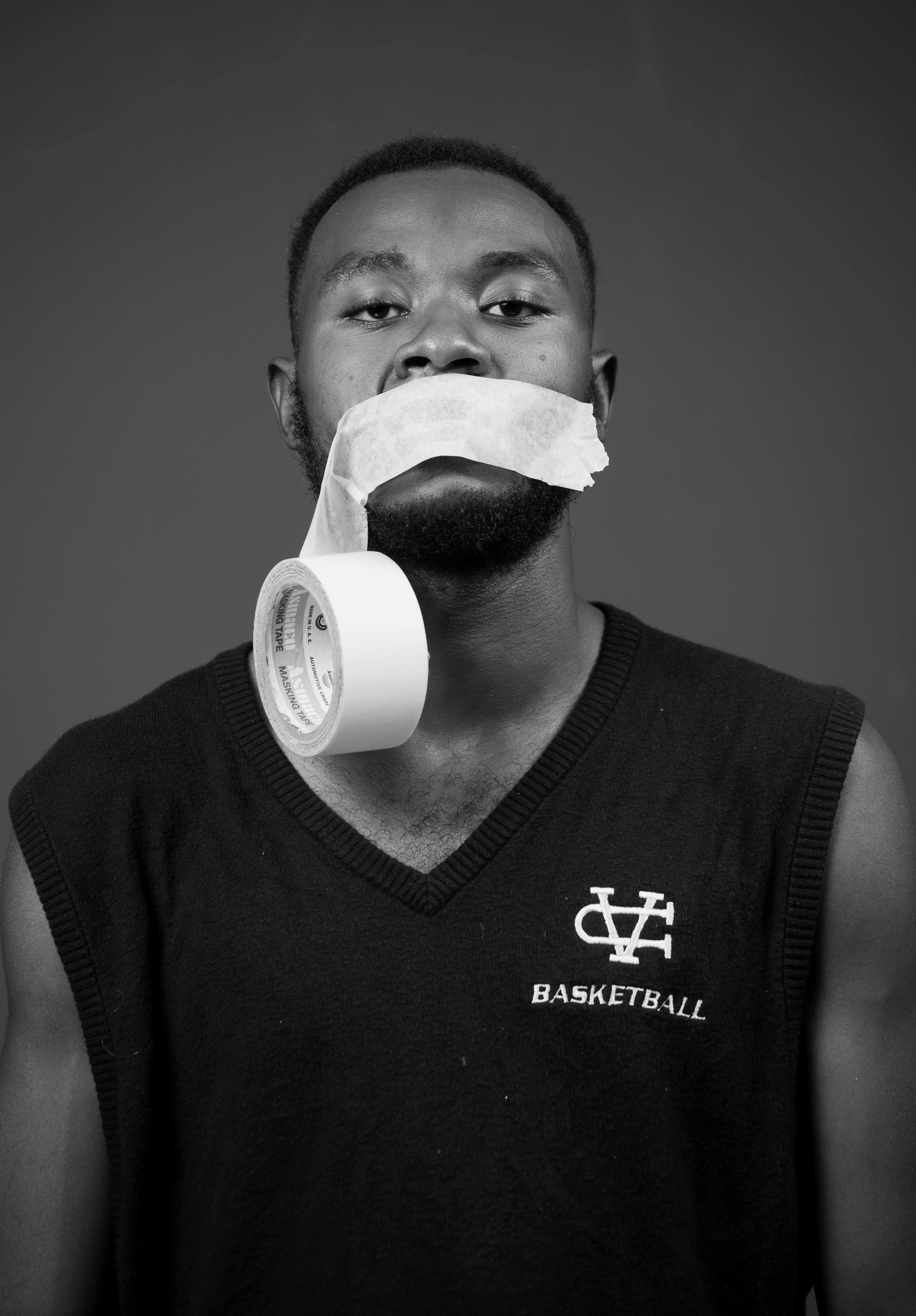 Black and White Portrait of Man with Mouth Taped Shut · Free Stock Photo