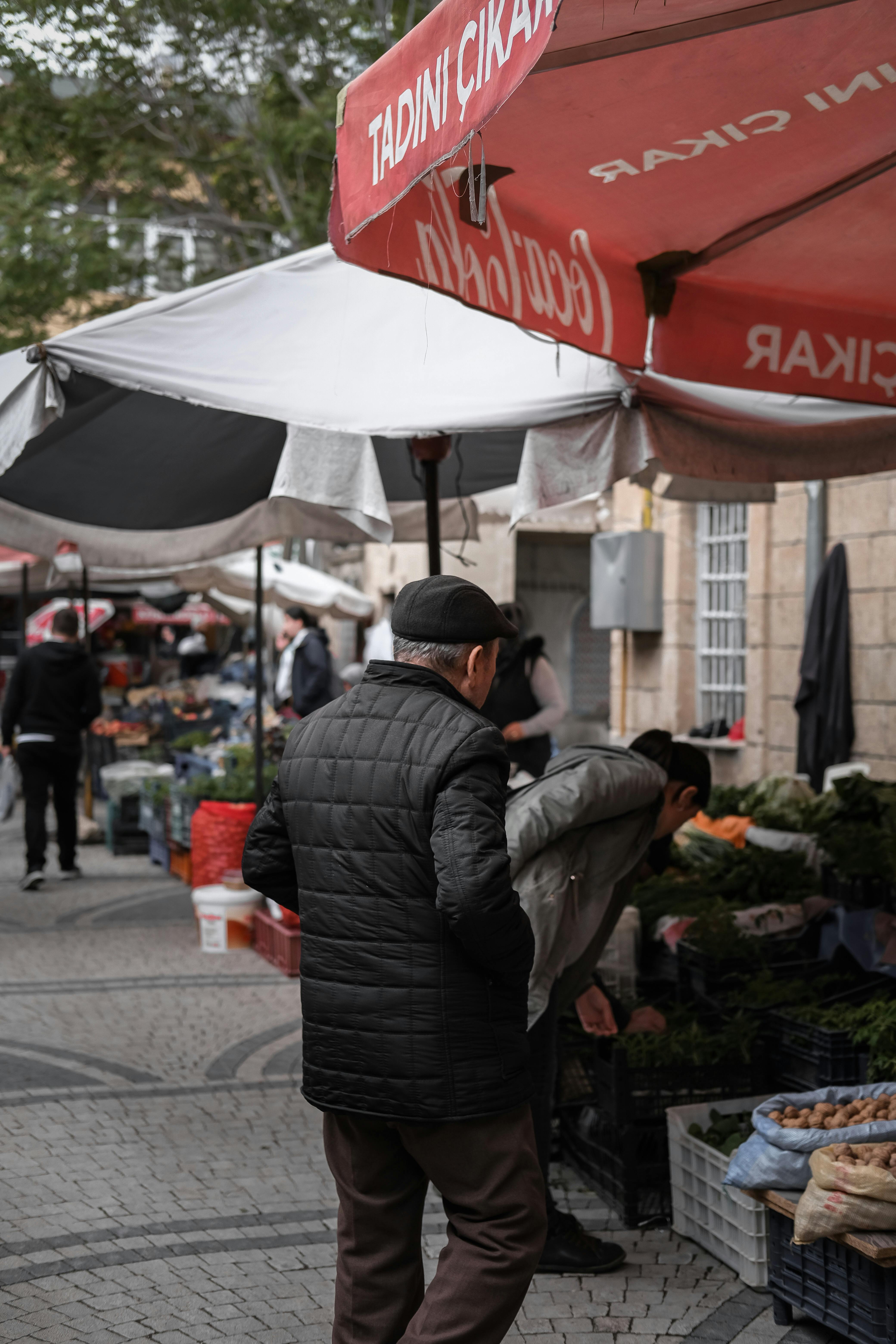 A Man Stacking the Fabric · Free Stock Photo
