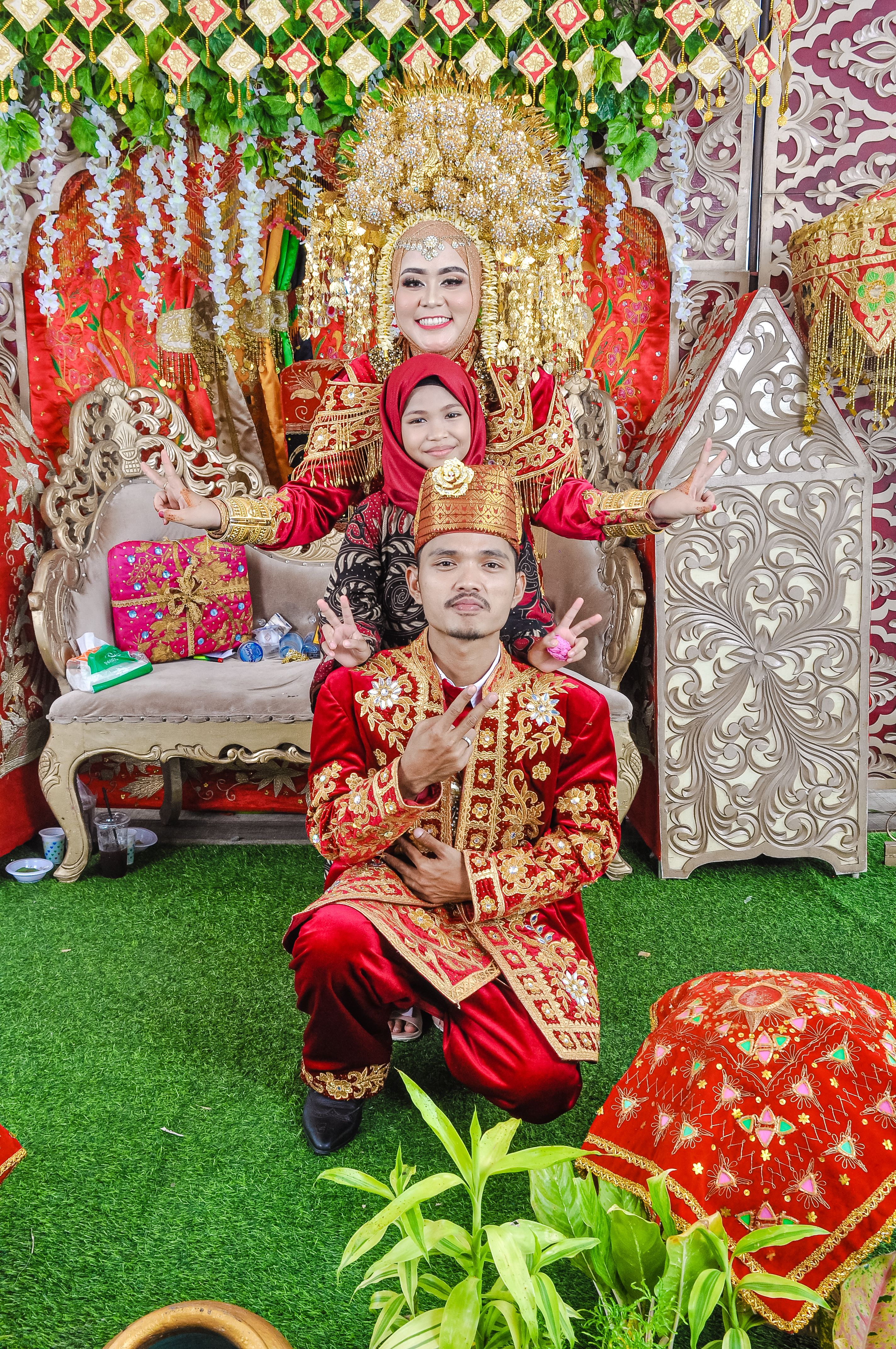 People Posing in Traditional Clothing · Free Stock Photo