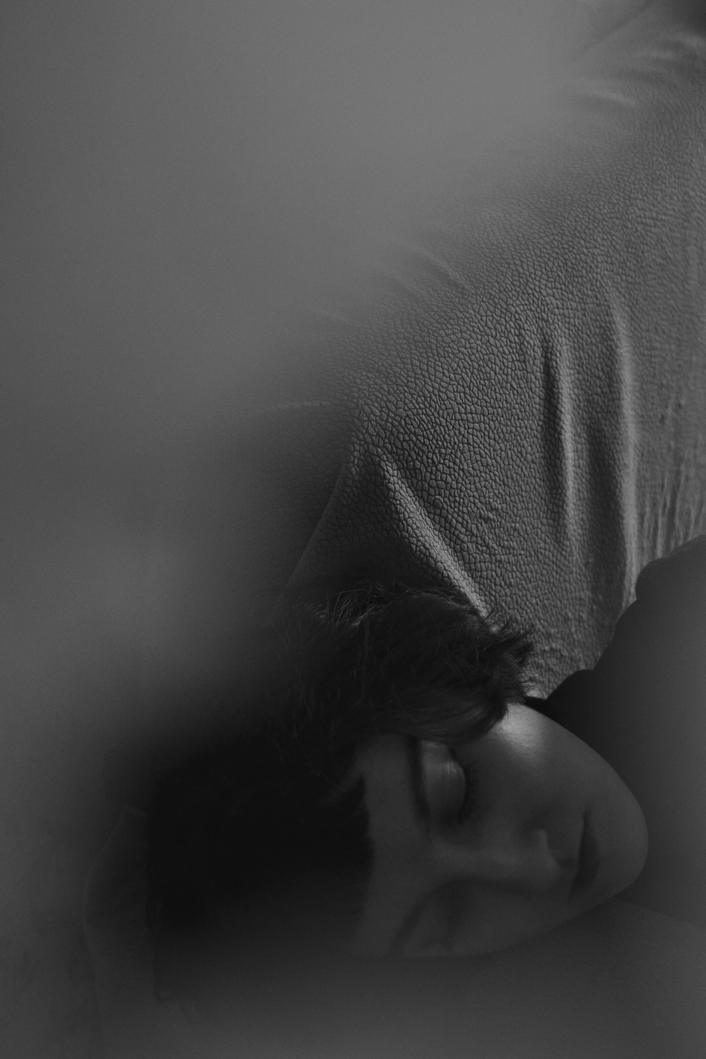 A woman laying on her back with her head in the air · Free Stock Photo