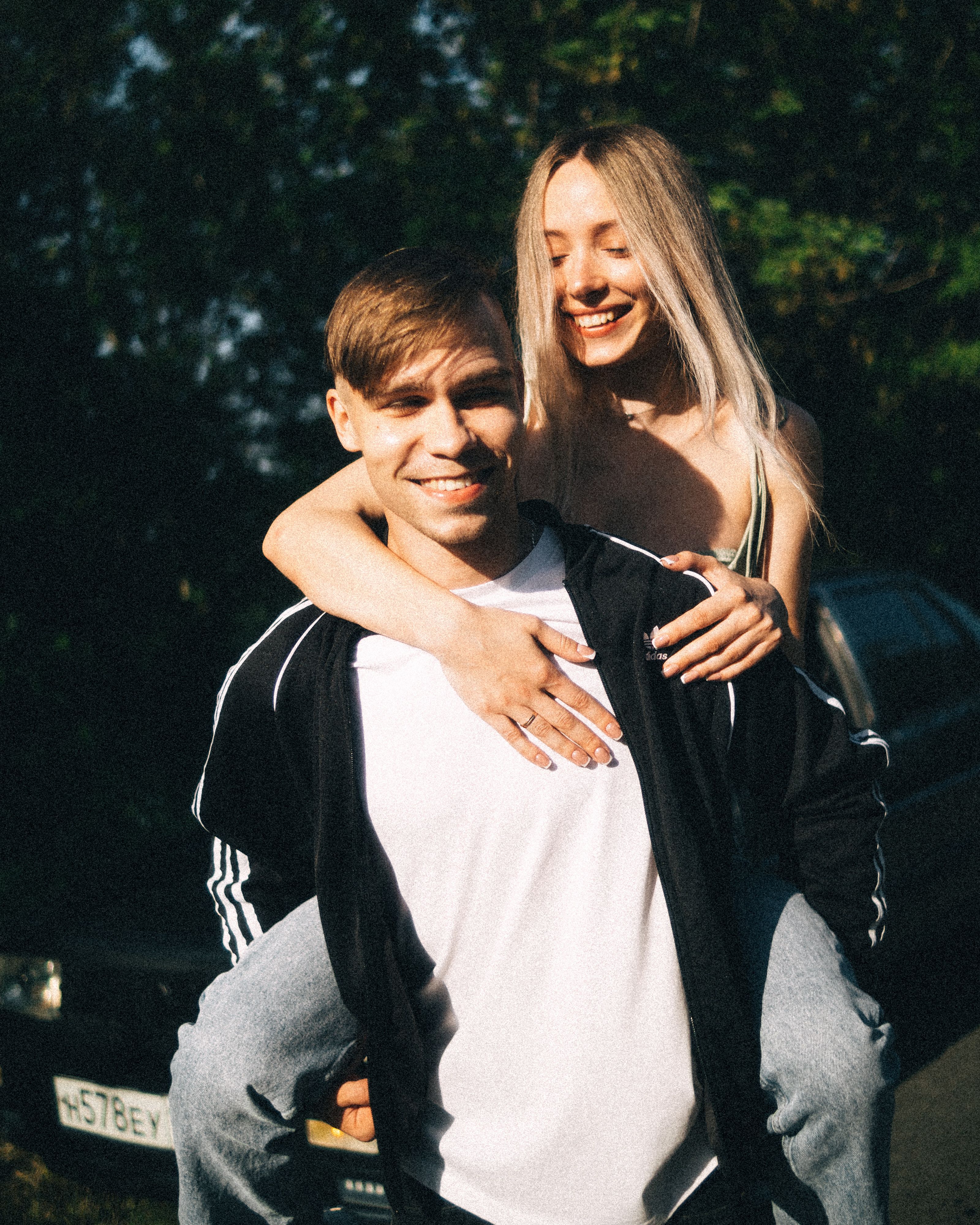 A Boyfriend Carrying His Girlfriend on His Back and Smiling · Free ...