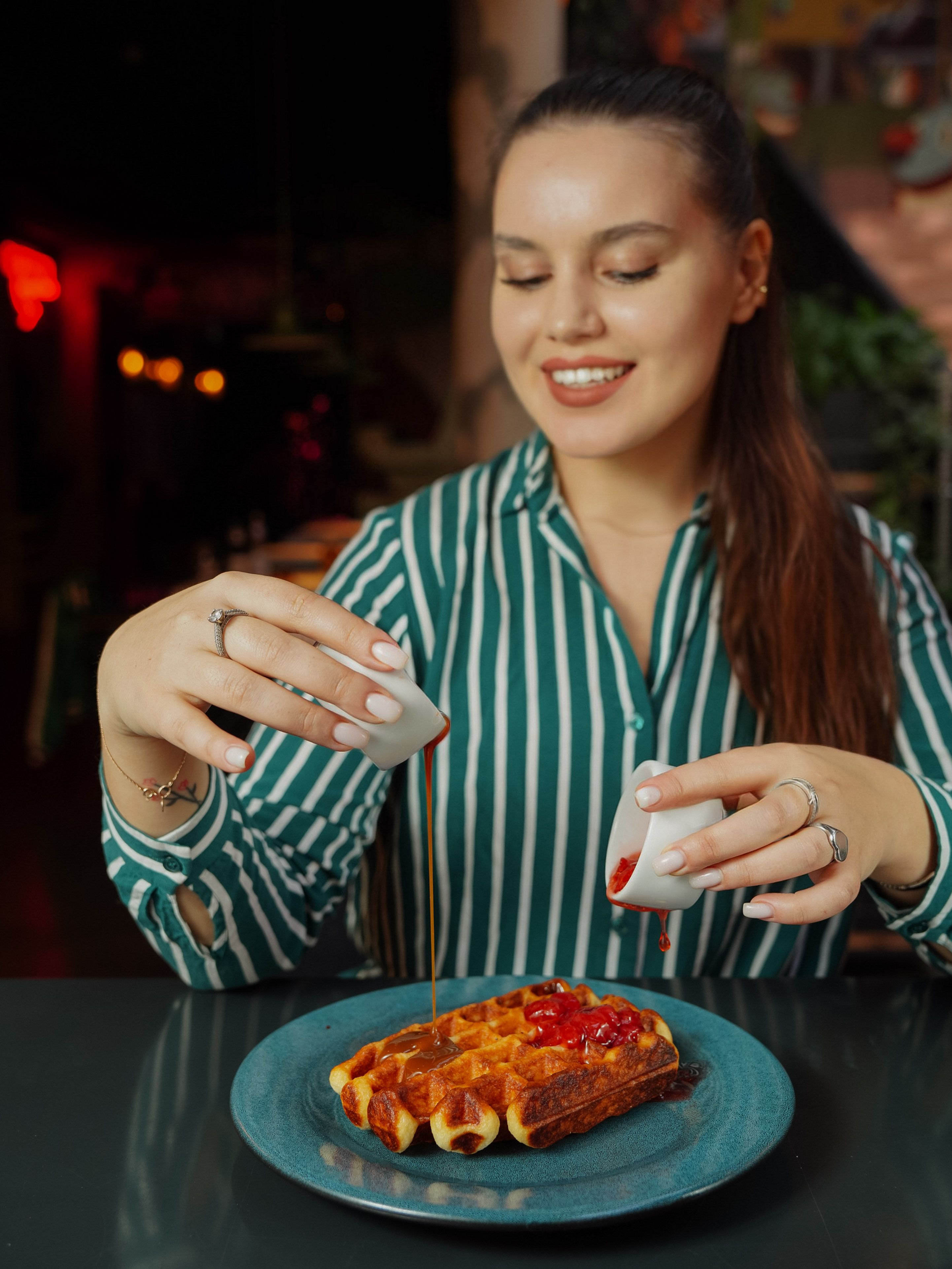 Woman Dipping Waffle in Syrup · Free Stock Photo