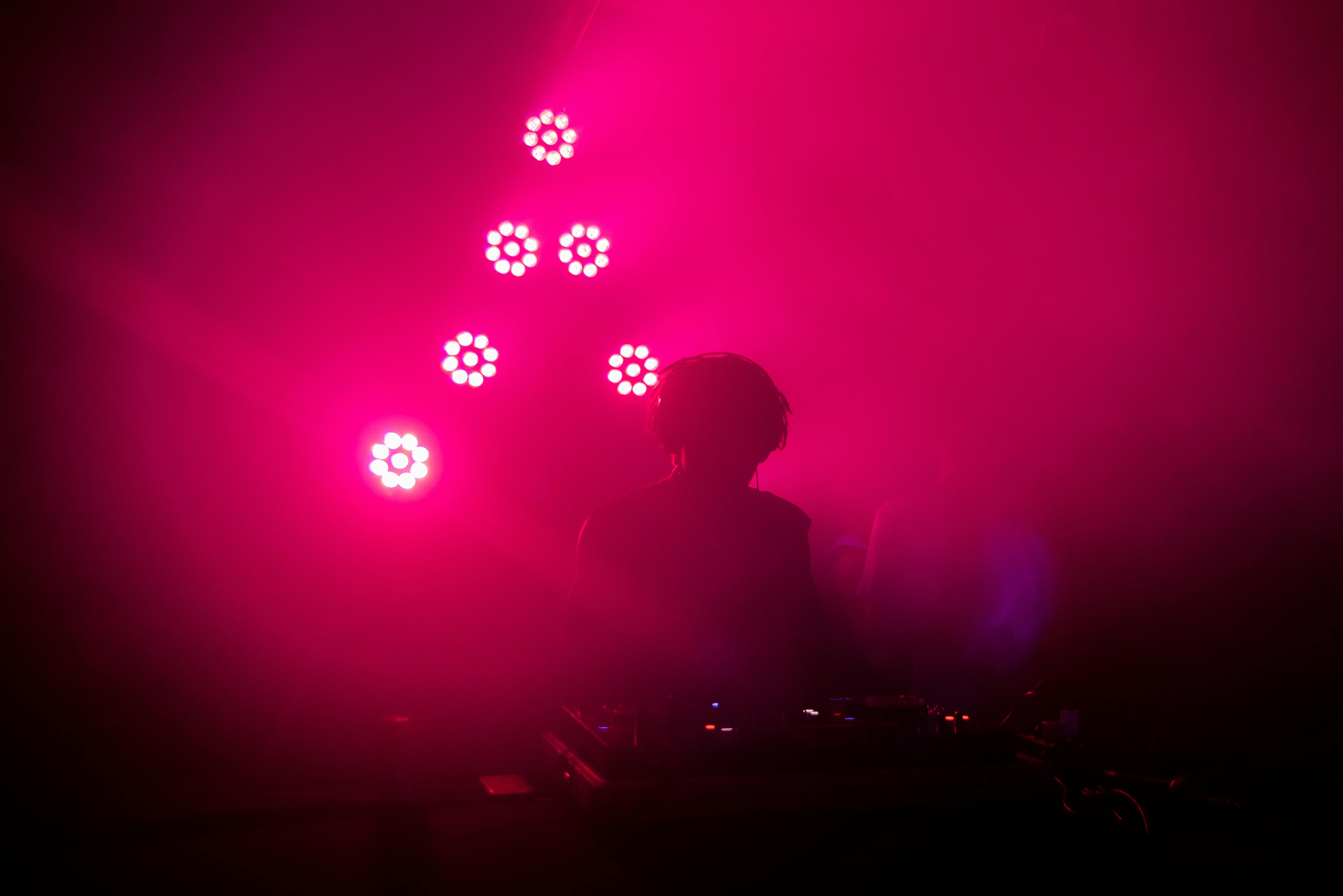 Red Light over DJ Silhouette · Free Stock Photo