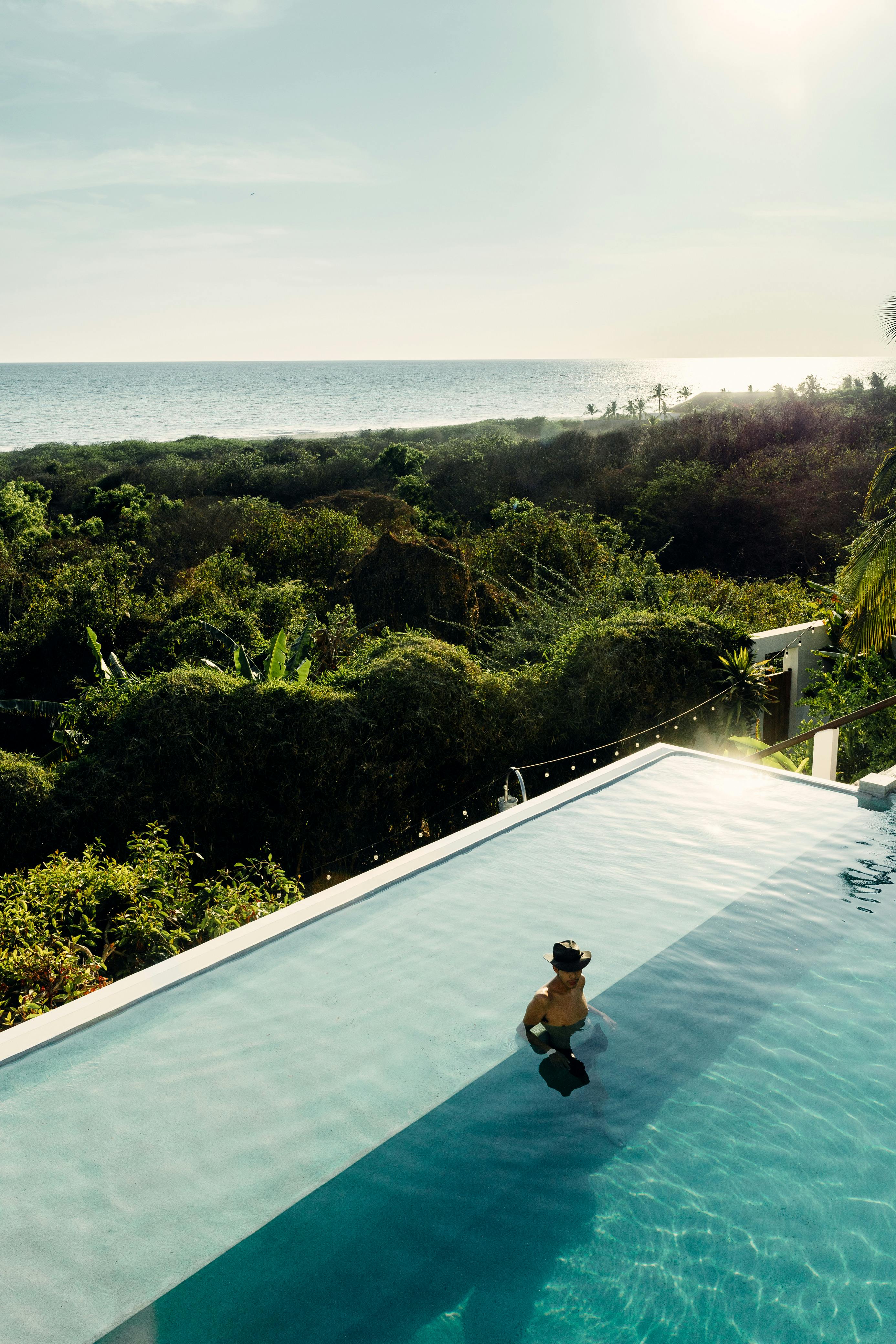 Man Standing in Swimming Pool · Free Stock Photo