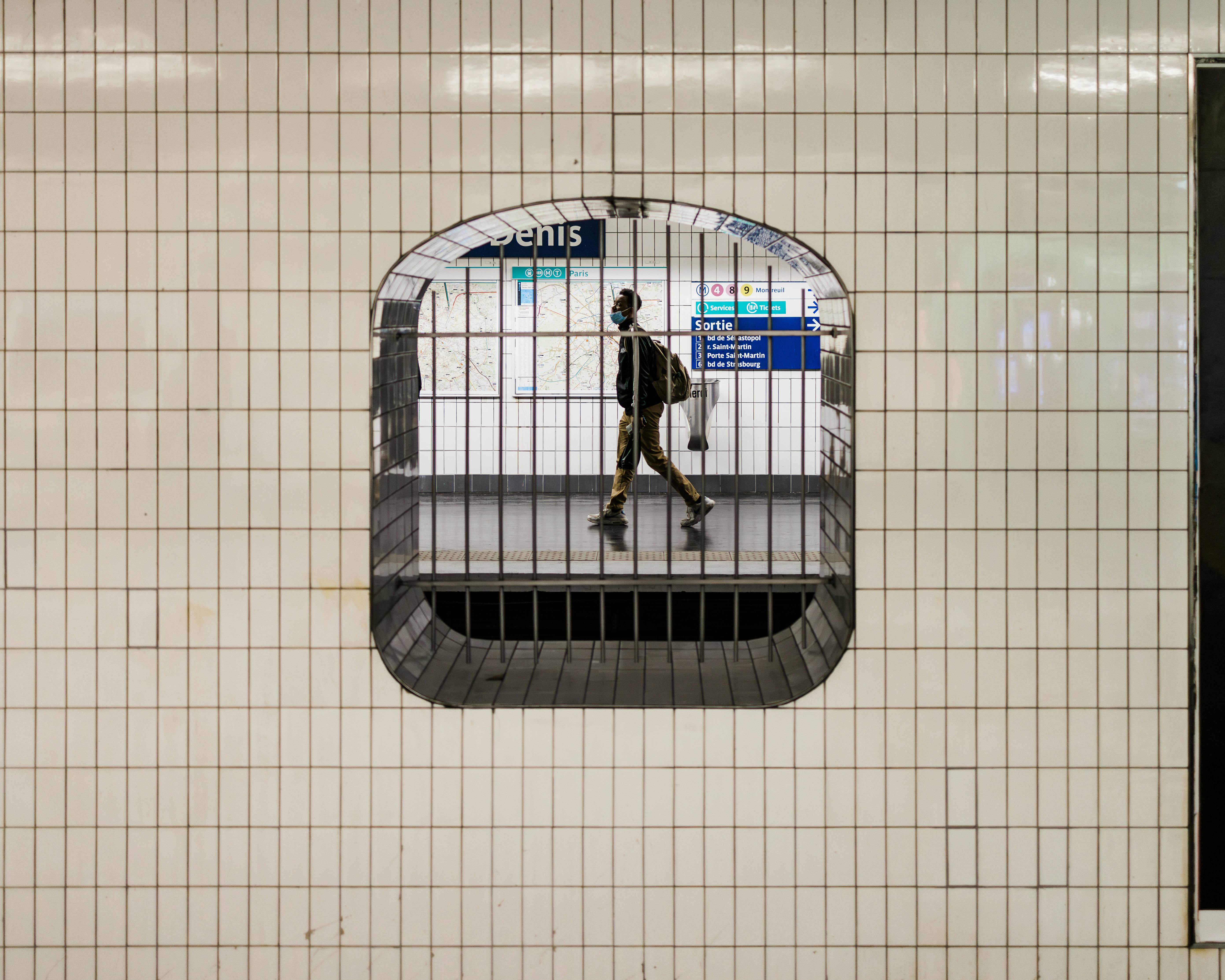 Man Walking along Running Subway Tray · Free Stock Photo