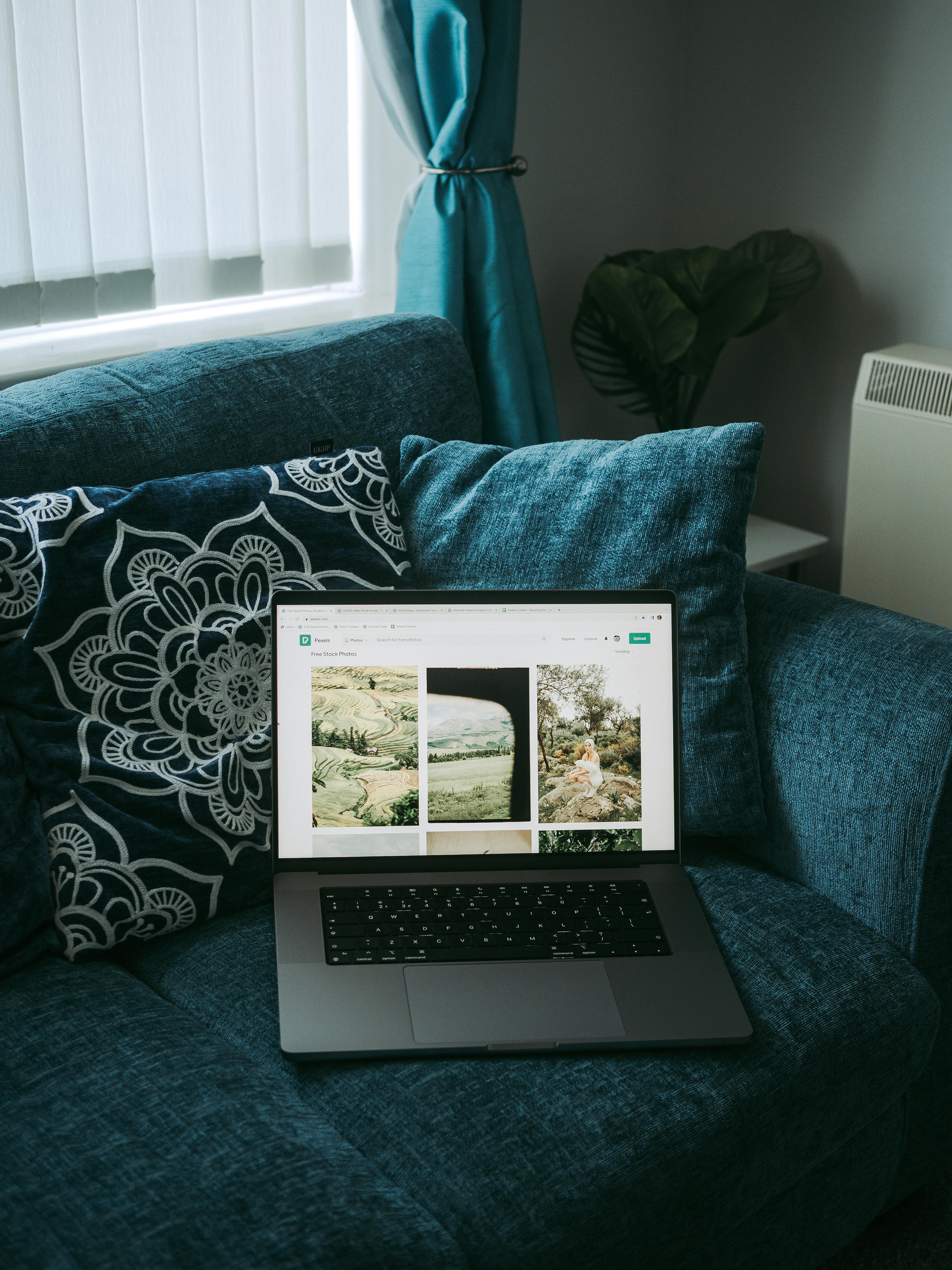Laptop on a Sofa in a Living Room · Free Stock Photo